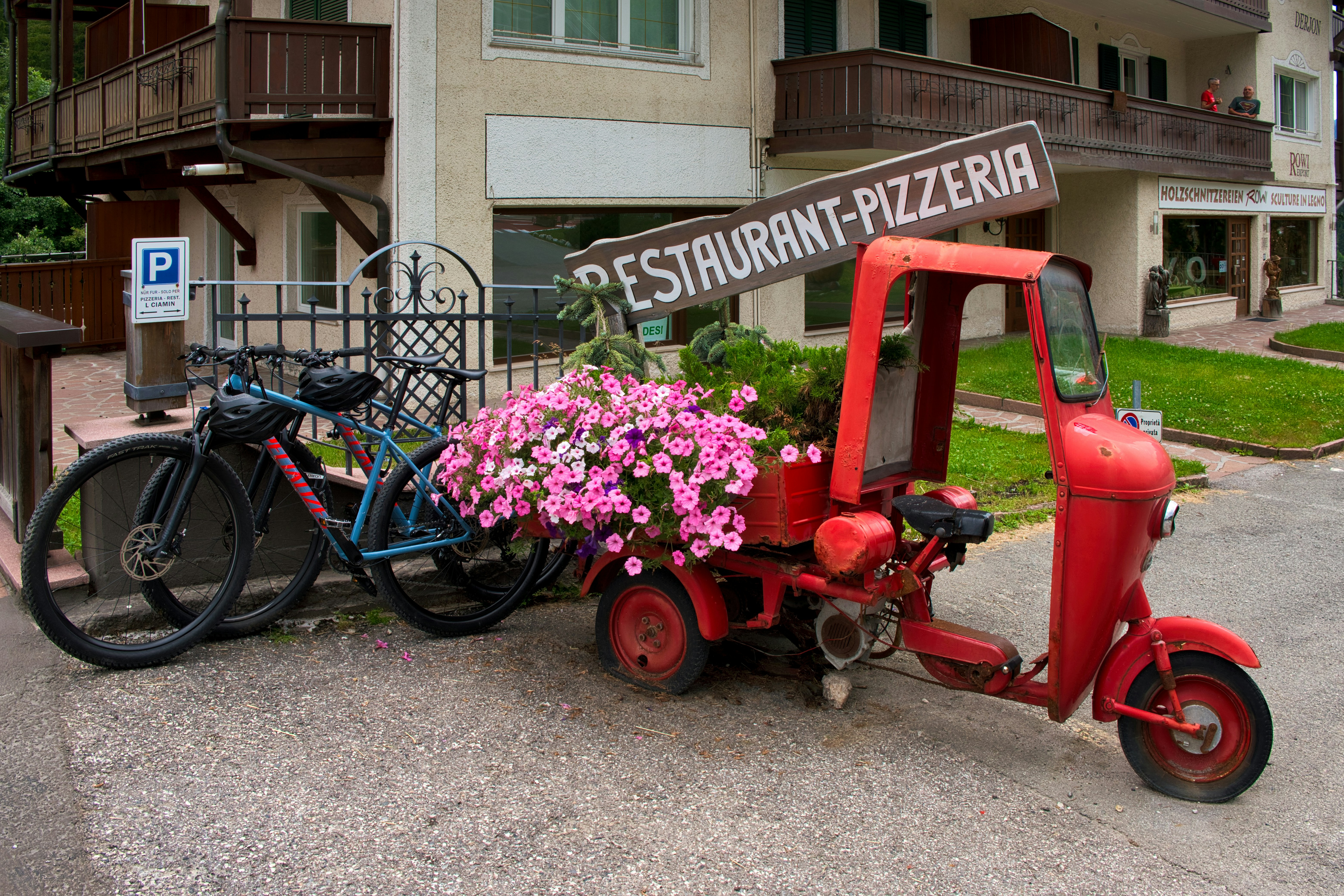 Red Flower Cart at the Pizzeria Corner
