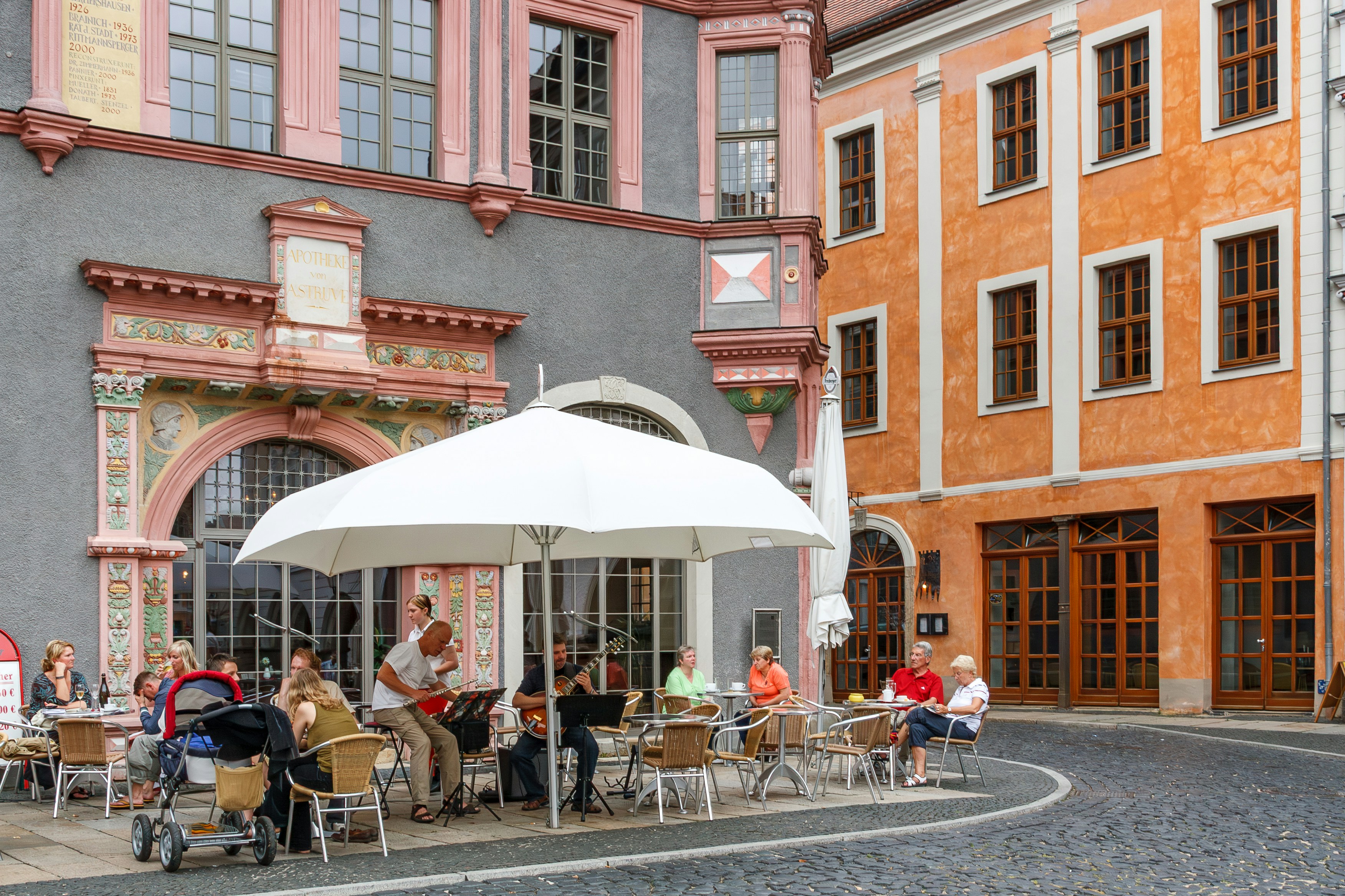 Cafe under the Arcade: Courtyards and Colorful Facades