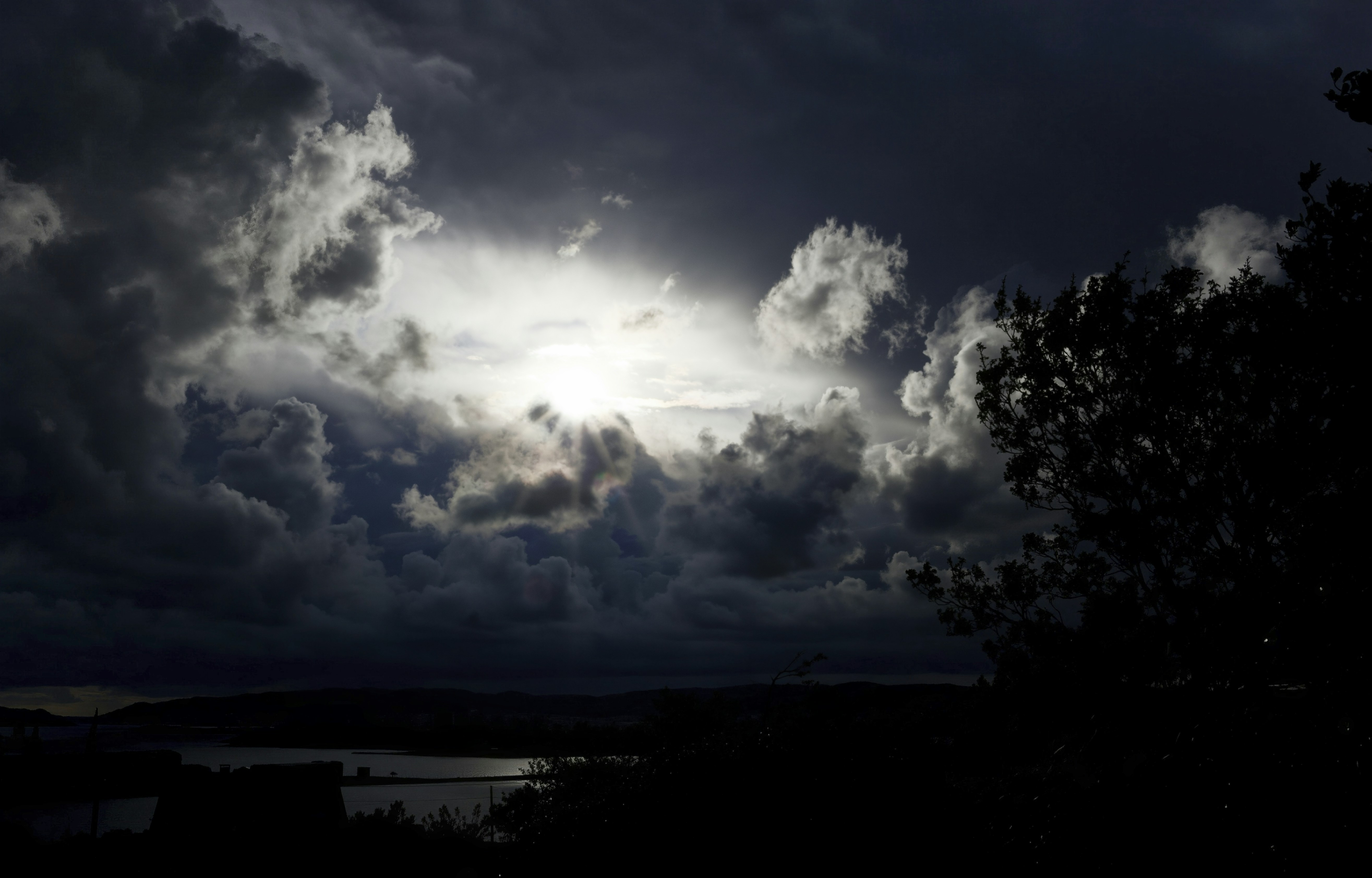 Partial Dawn Over a Storm-Laden Landscape