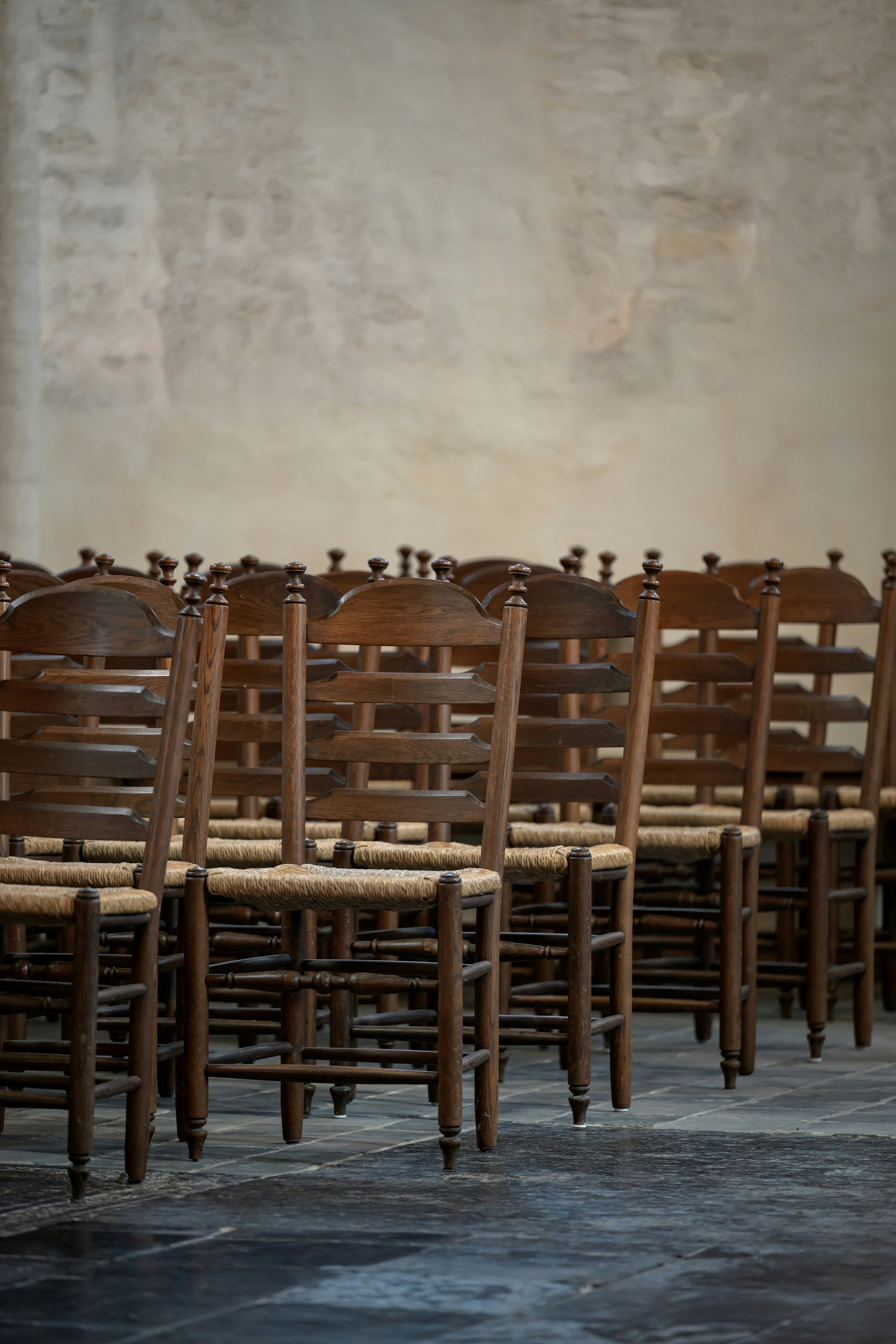 Row of Vintage Wooden Chairs in a Quiet Interior