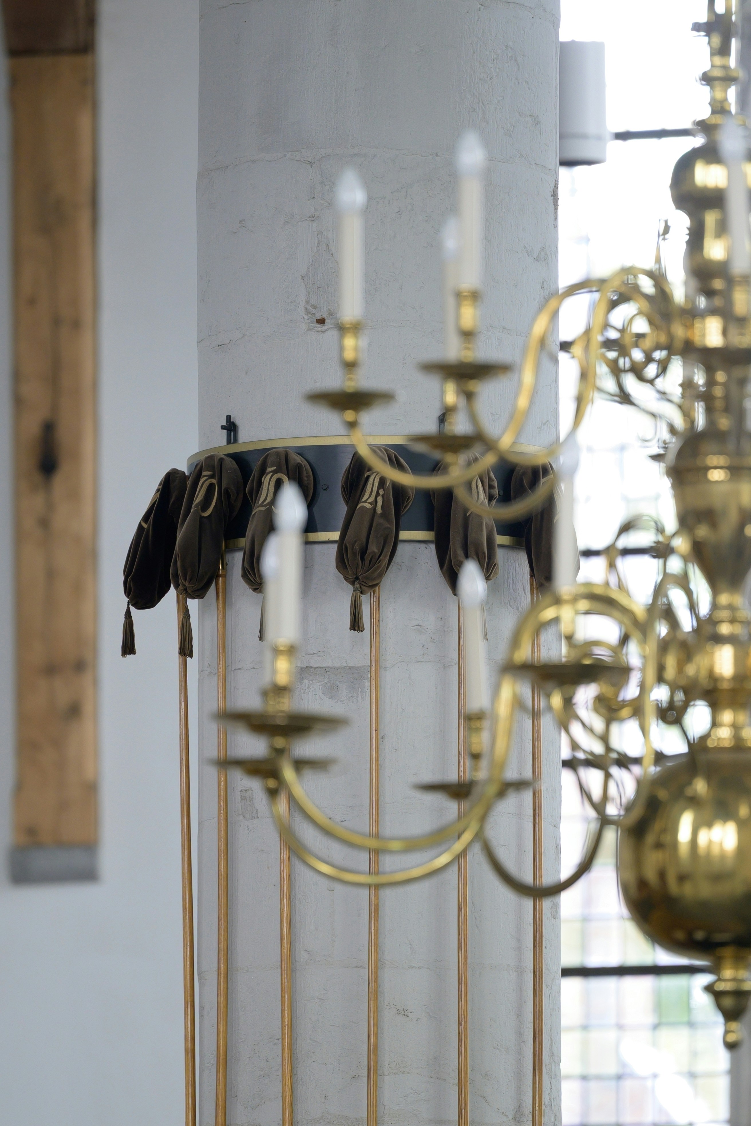 Candlelit Choir of Iron and Brass in Quiet Cathedral
