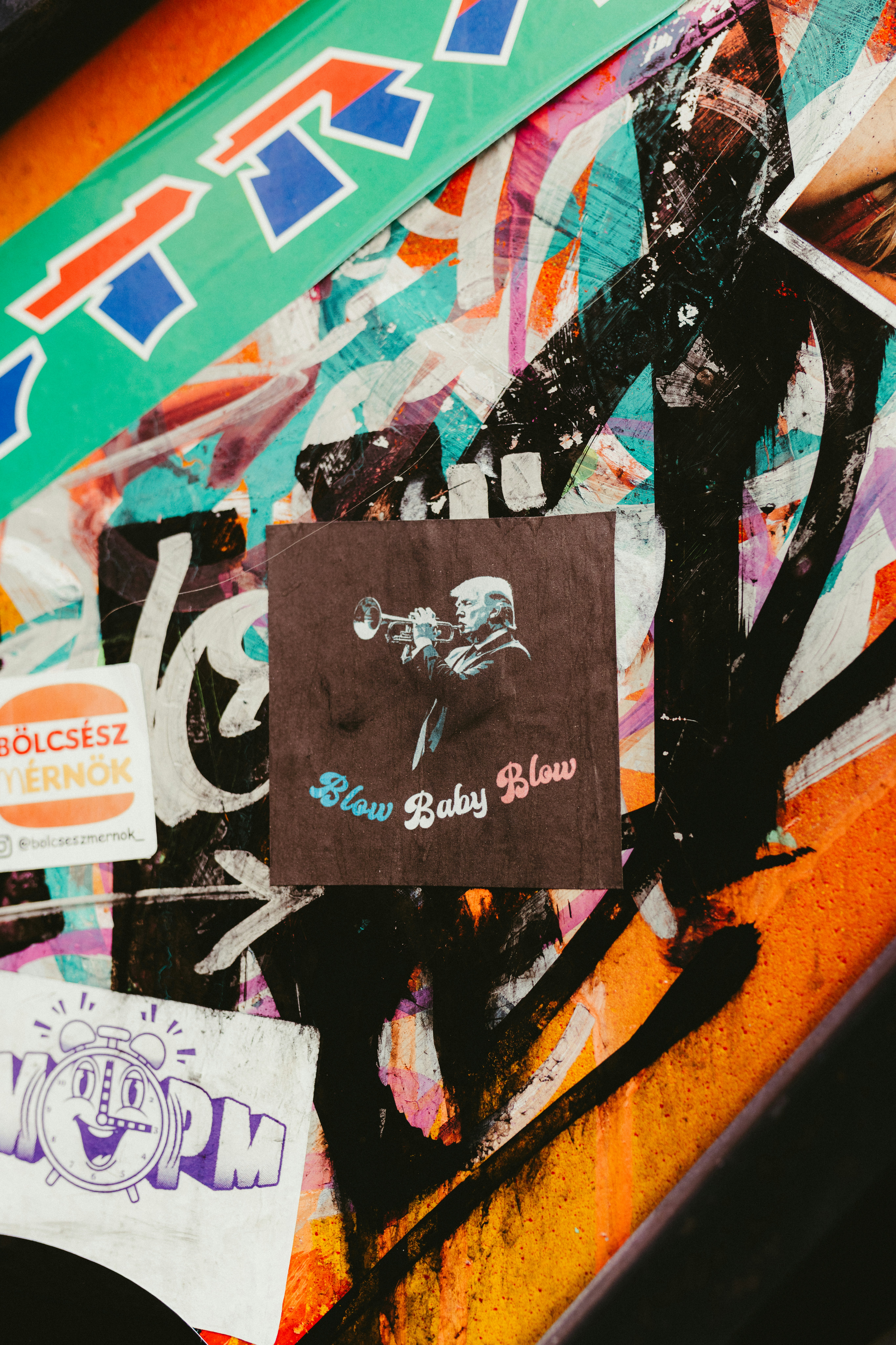 Stickered Wall Portrait: A Burst of Graffiti with a Central Sticker
