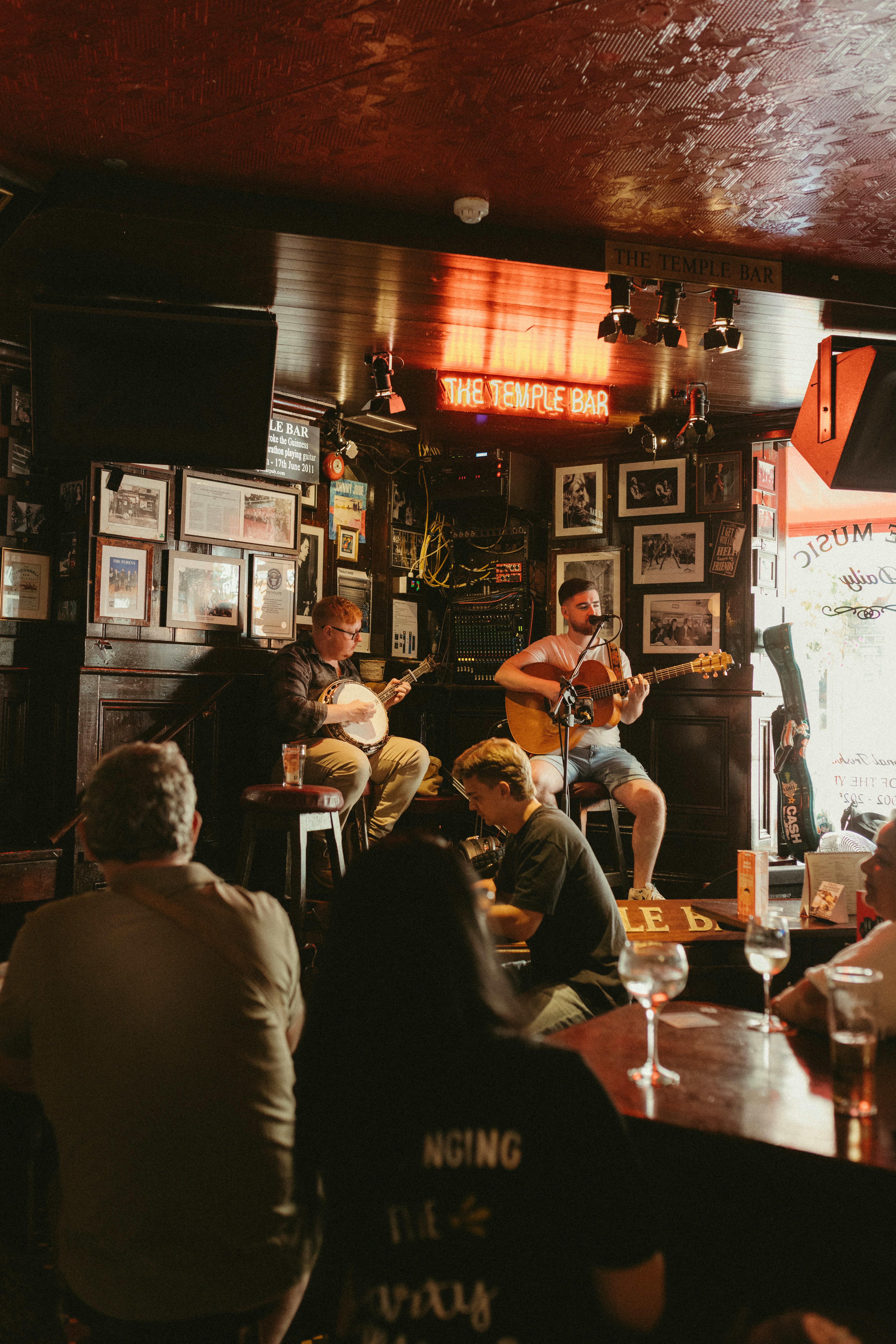 Midnight Jam at The Temple Bar: Acoustic Duo in a Portrait-Mode Live Scene