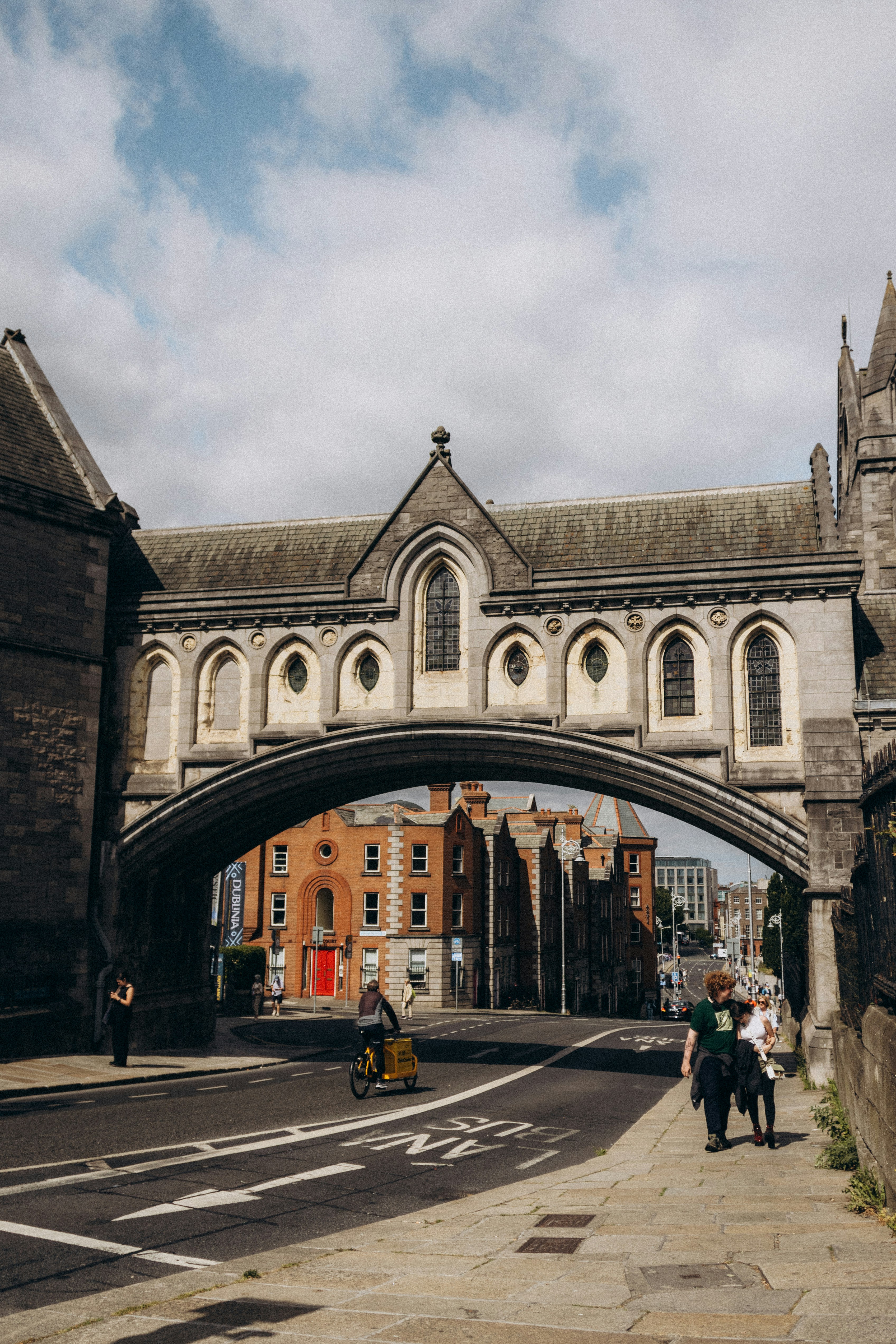 Stone Archway Over a Busy City Street