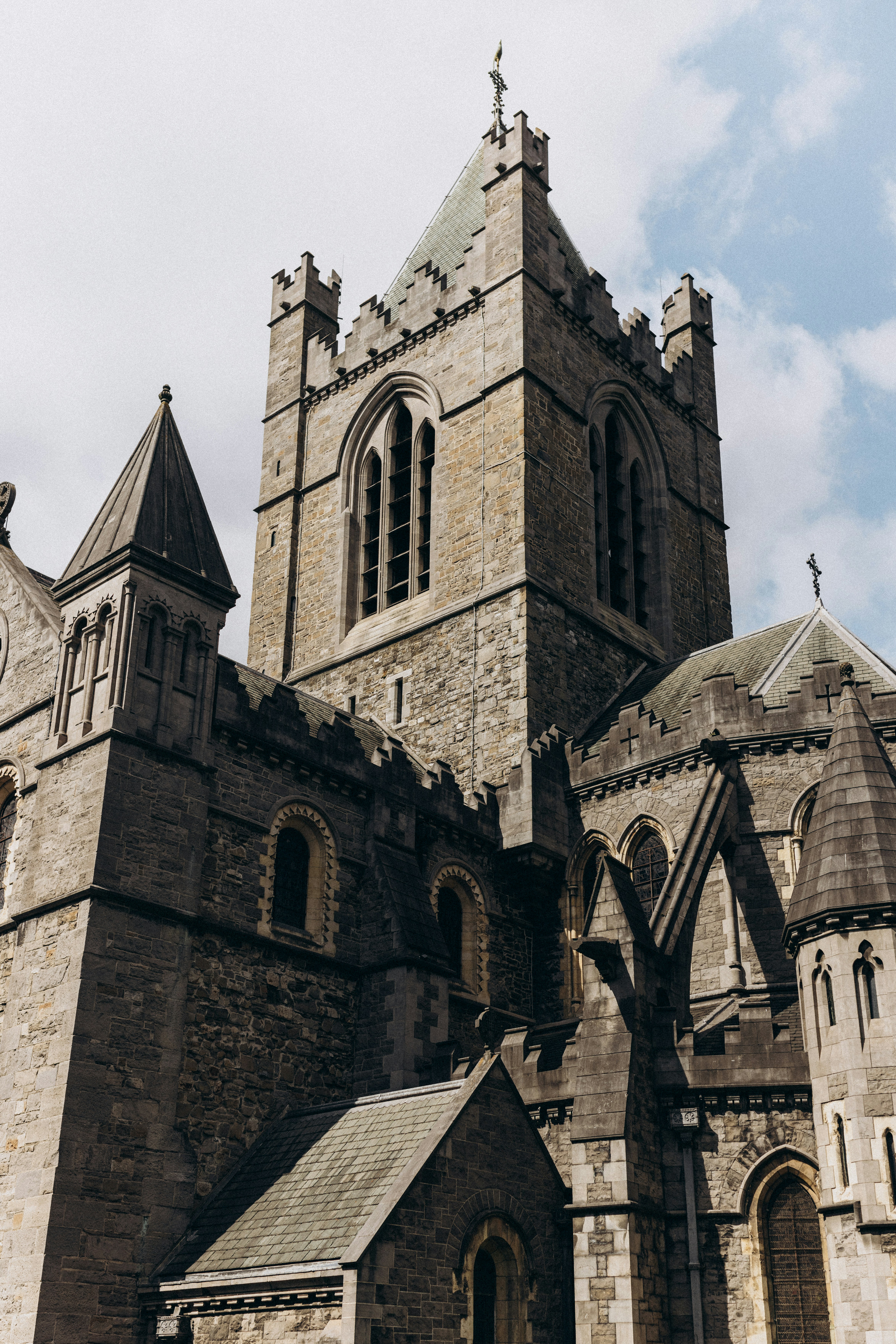 Gothic Cathedral Facade: Stone Towers and Arched Windows Reaching Toward the Sky