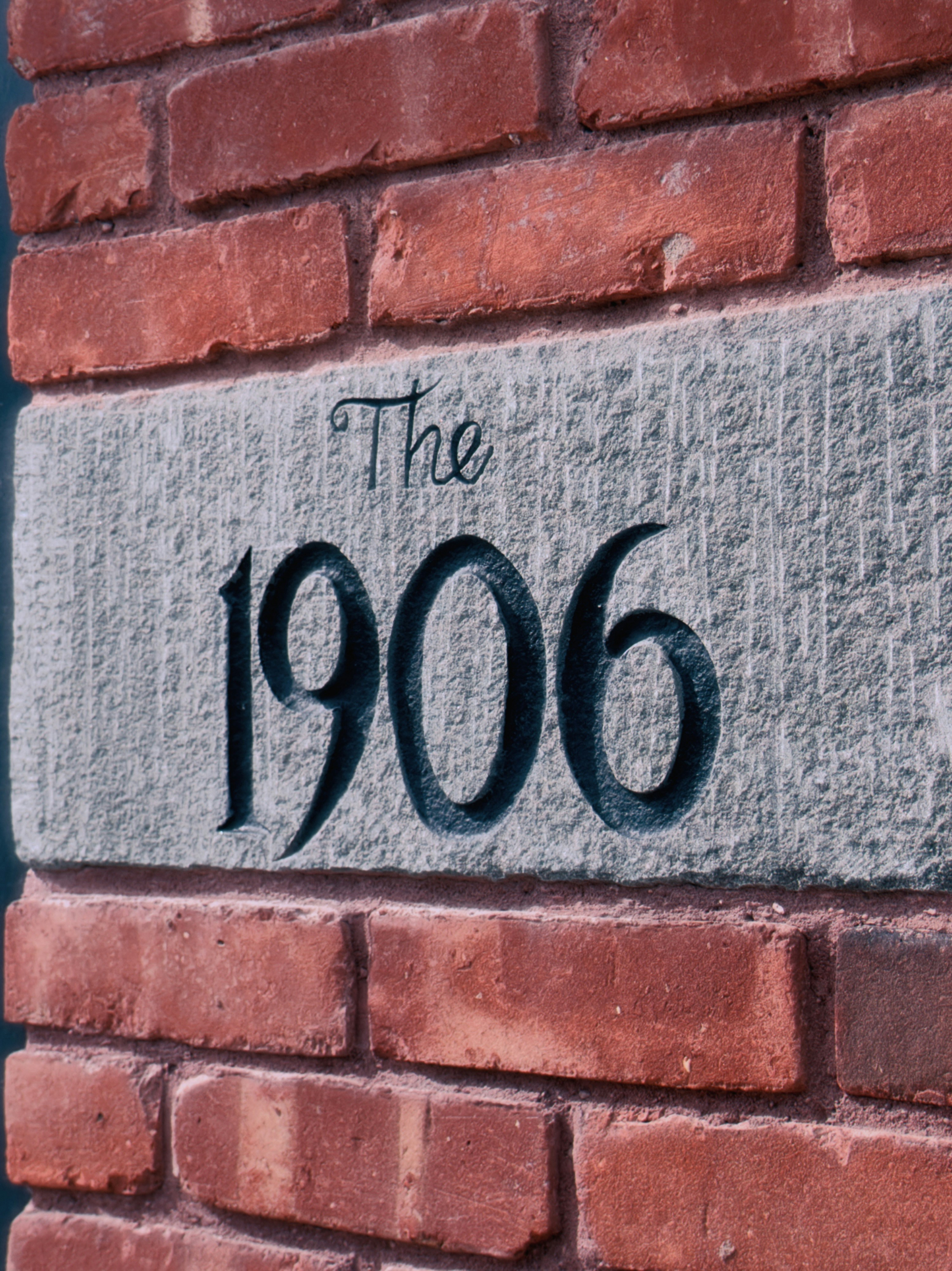 The Year Carved in Stone: 1906 on a Brick Facade