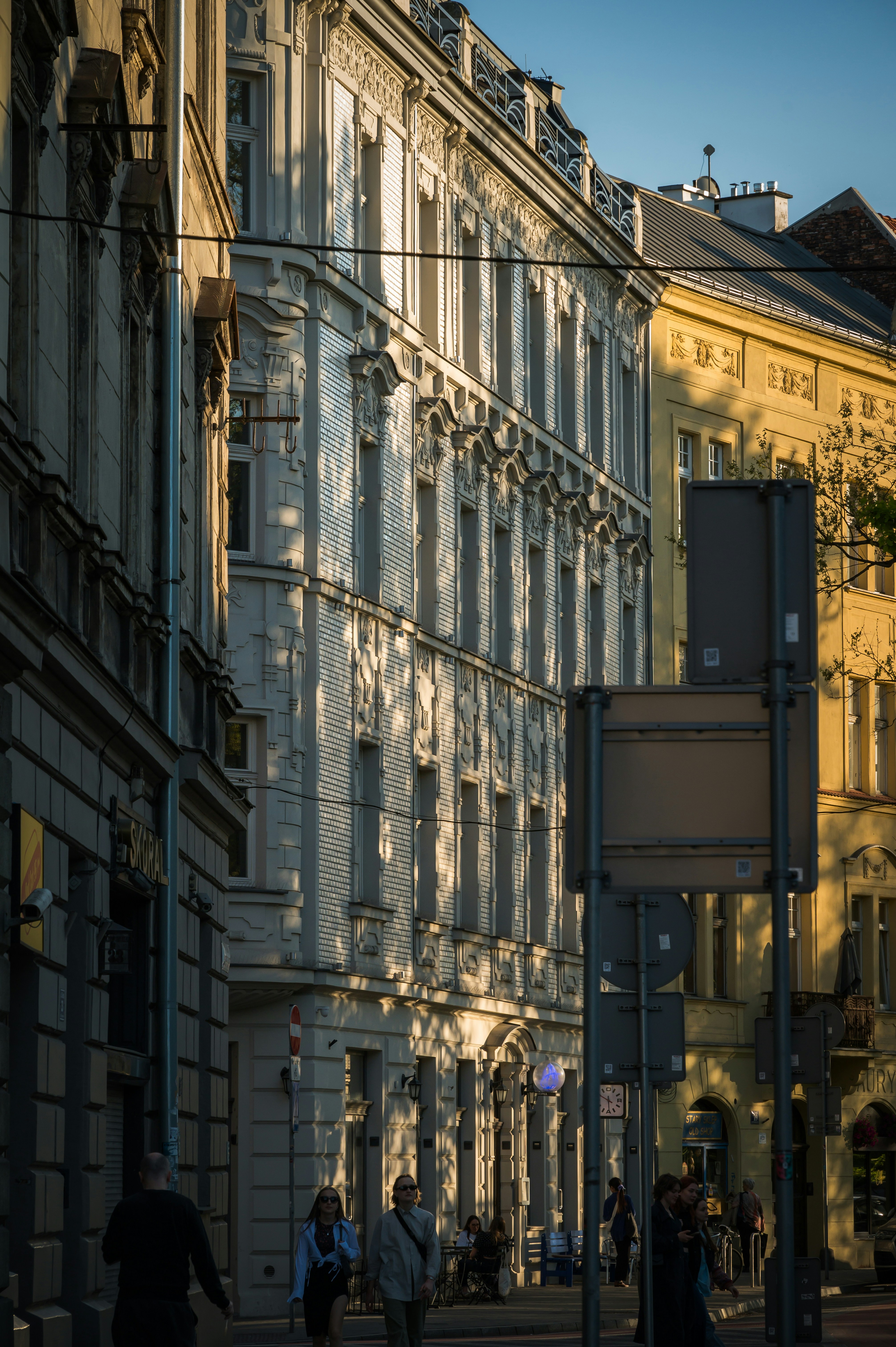 Sunlit Facade Walk: A Quiet Street in Golden Hour