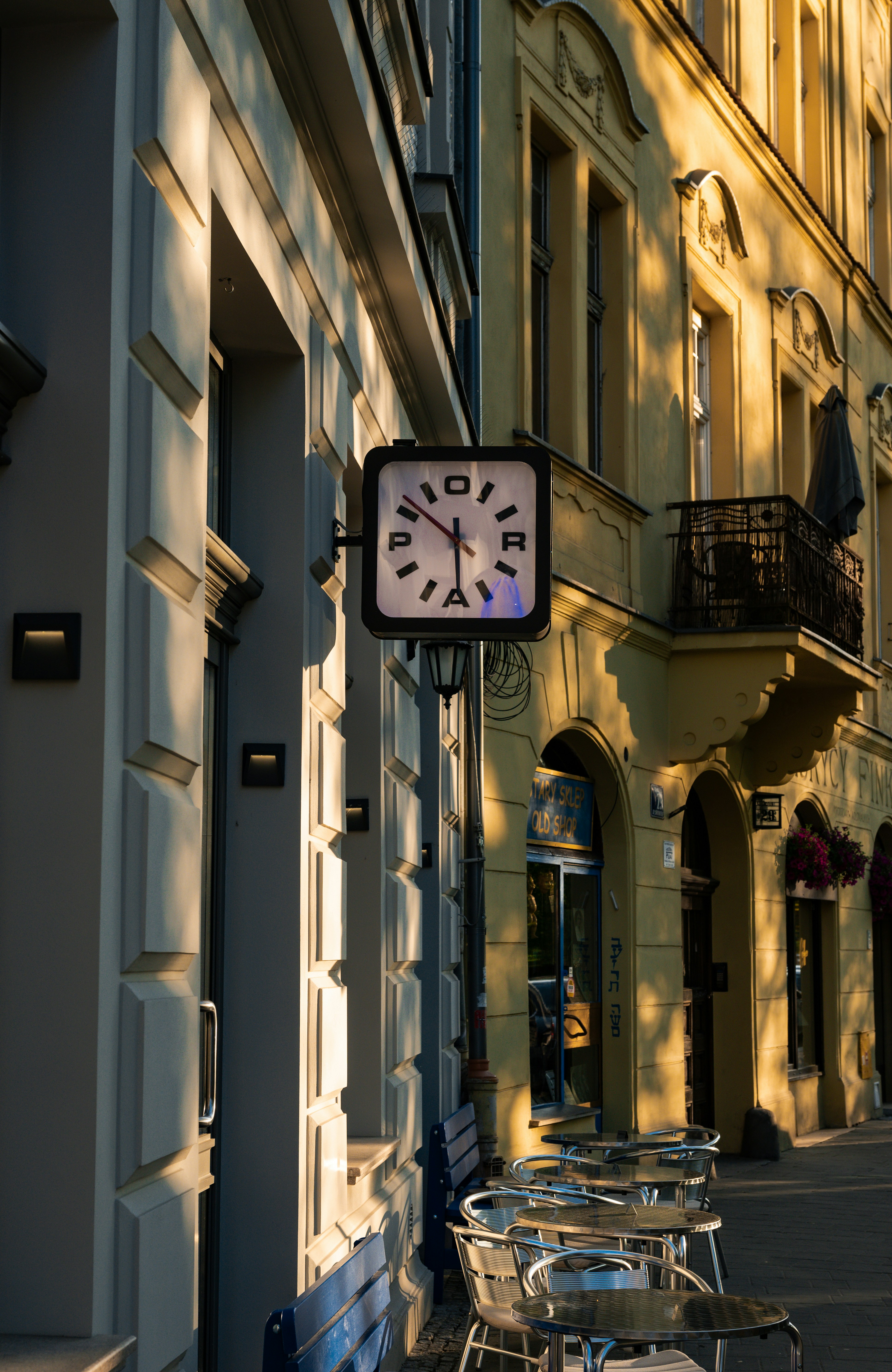 Golden Hour Clocktower Street: Sunlit Facade and Outdoor Calm