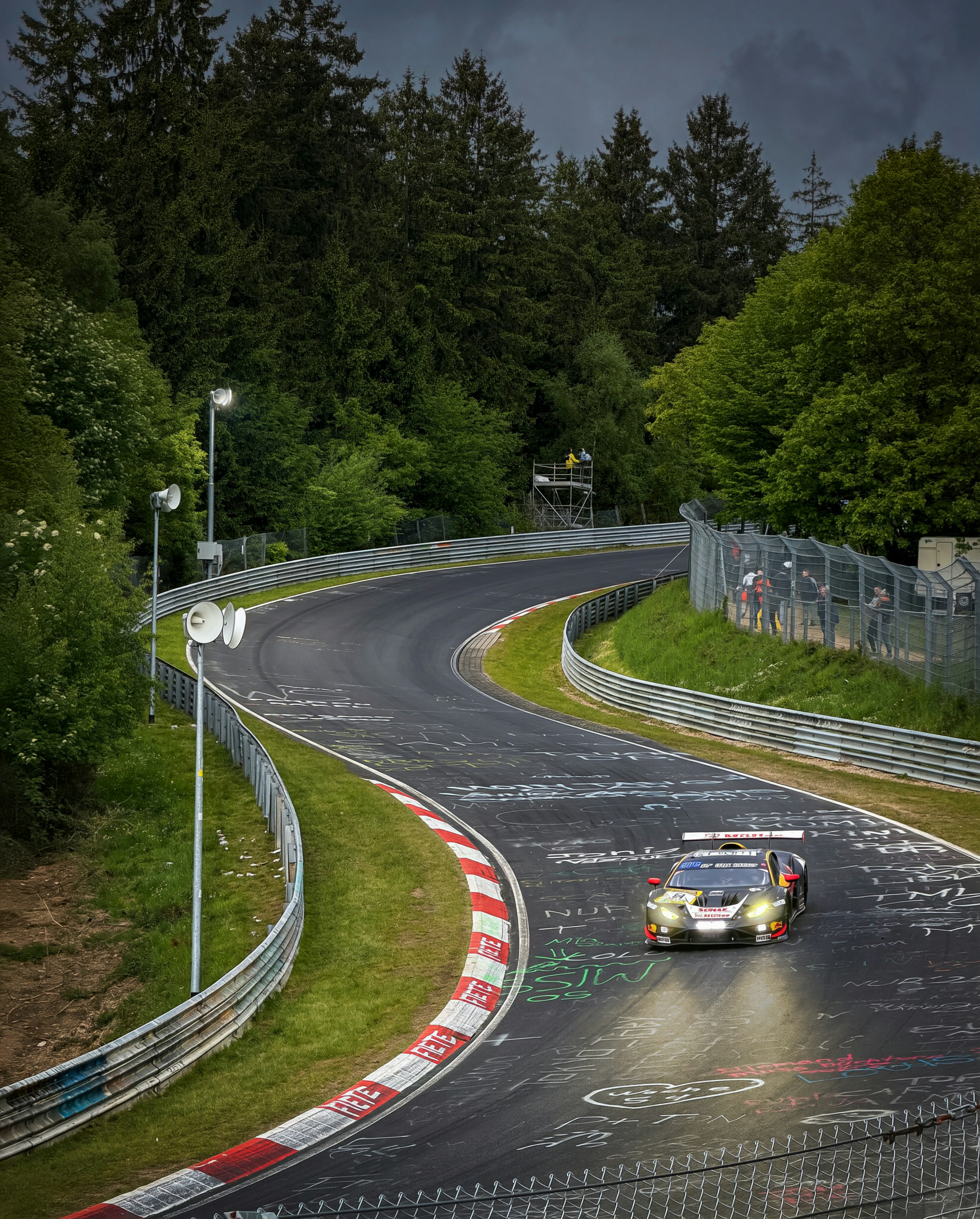 Racecar Rounds the Graffiti-Lined Hairpin