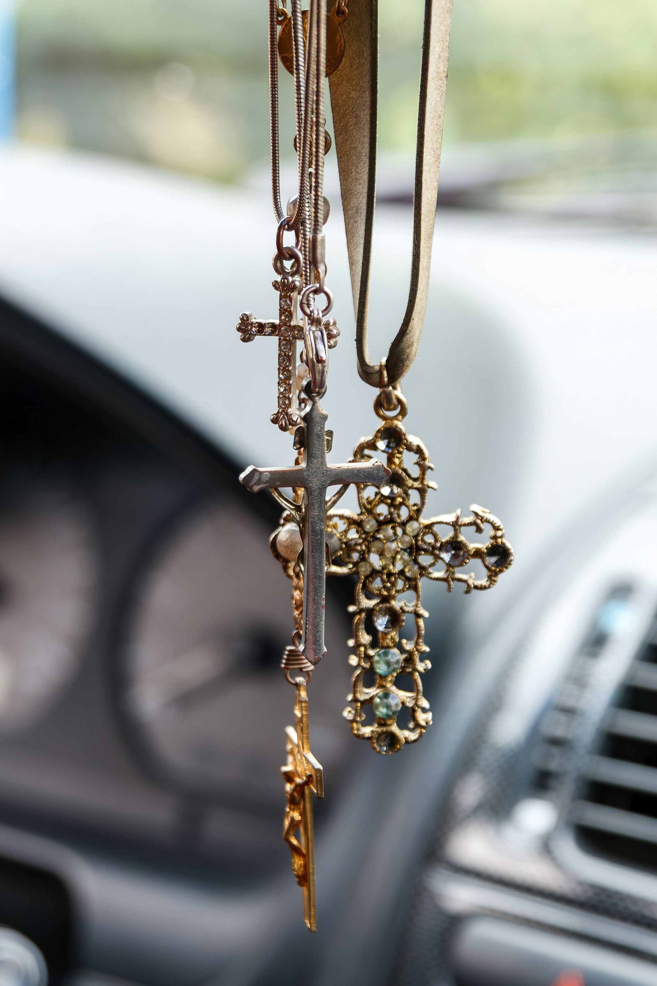 Hanging Reverence: Chains of Faith in the Car Interior