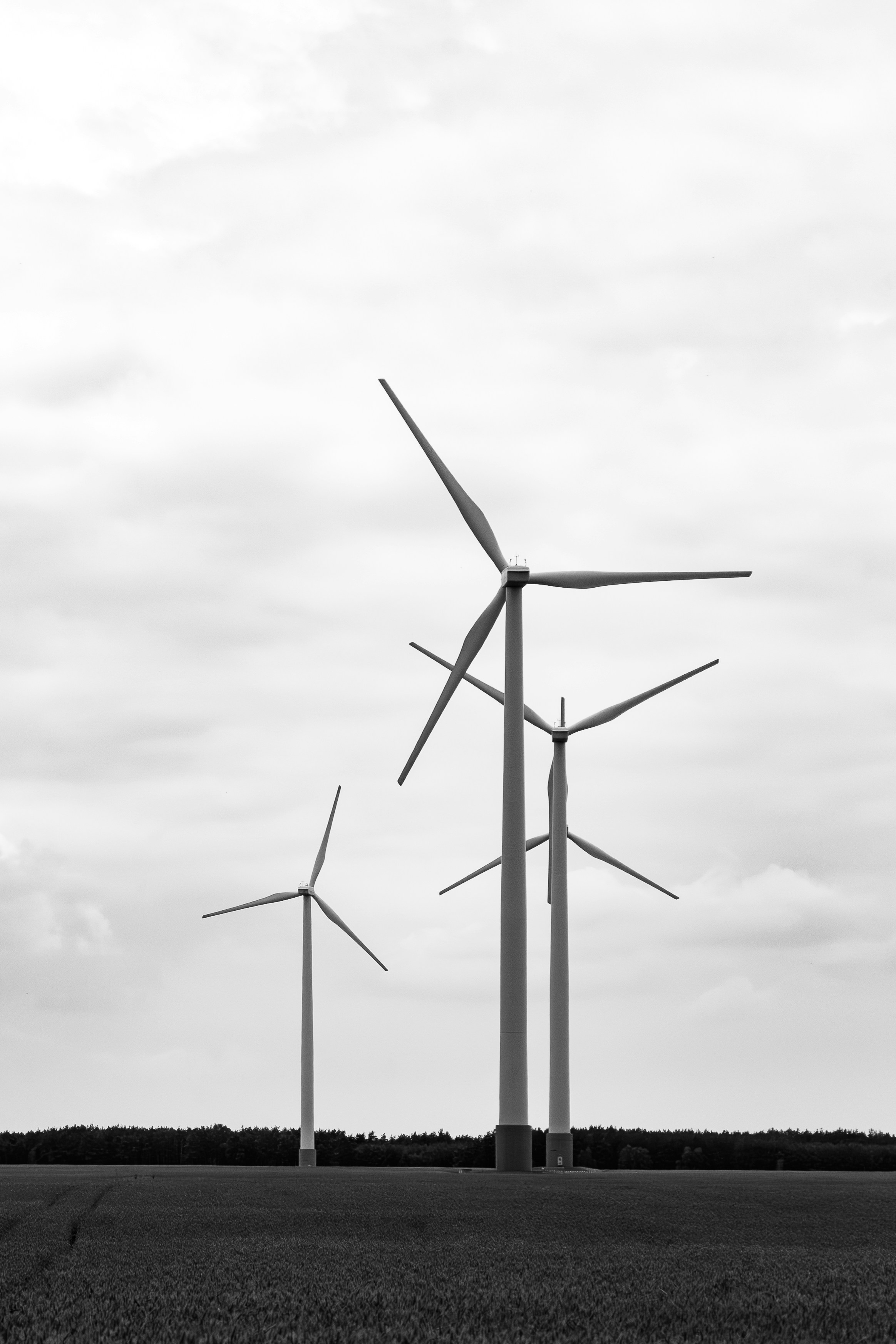Majestic wind turbines on a flat horizon