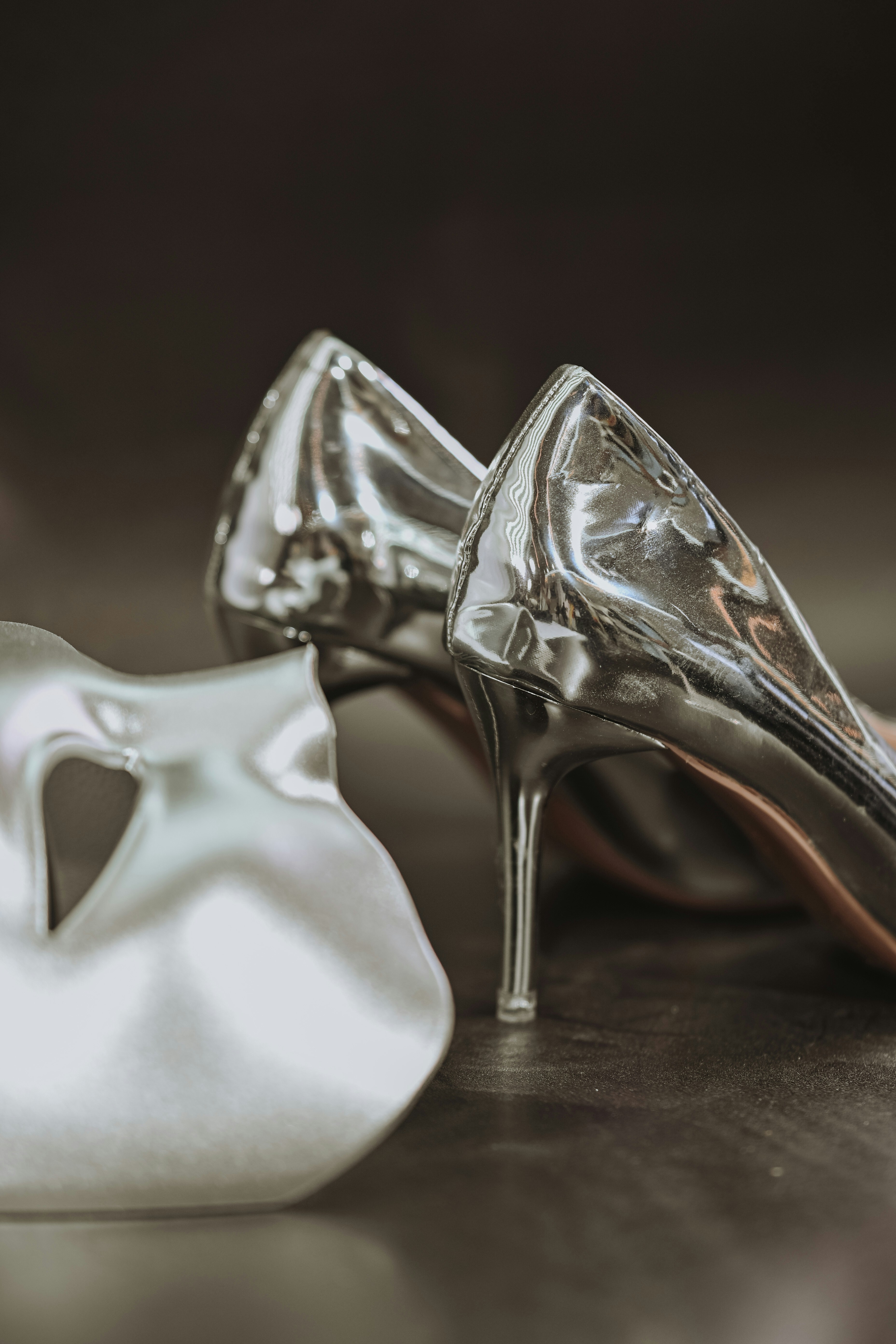 Shimmer and Shadow: Metallic Heels Tucked in a Quiet Studio