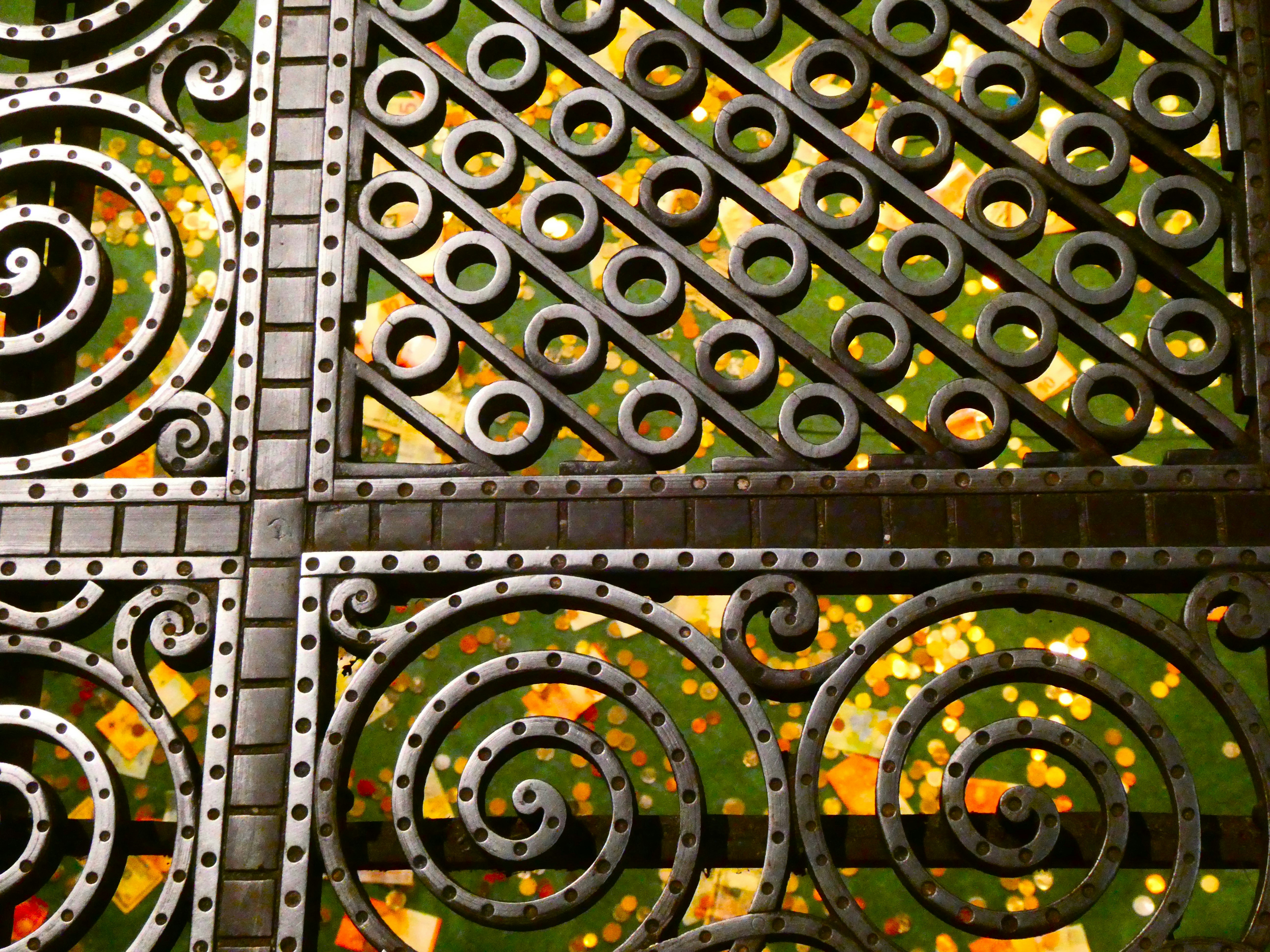 Ornate Ironwork with Sunlit Orbs