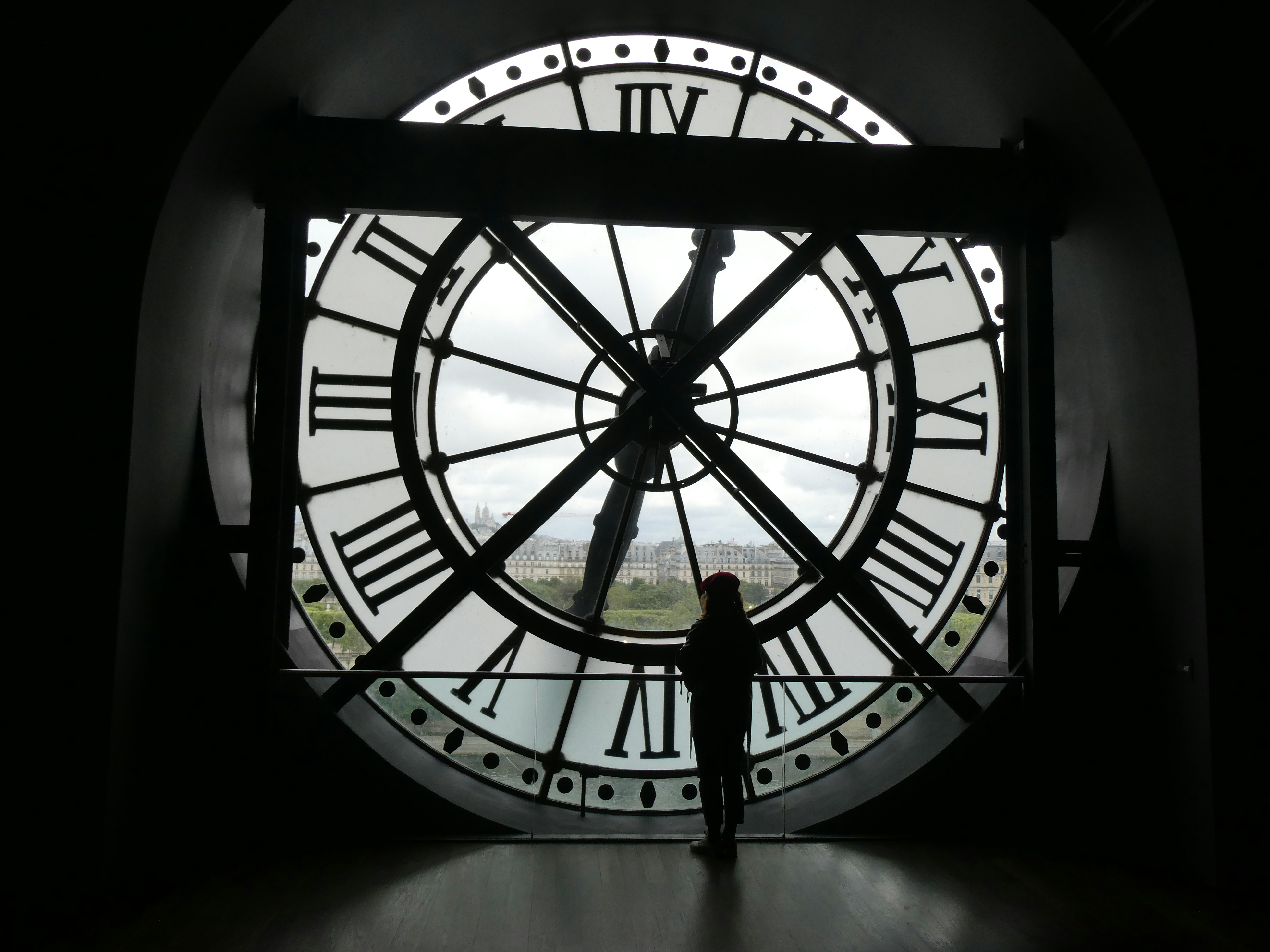 Silhouette at the Heart of Time: A Clock Tower Portrait