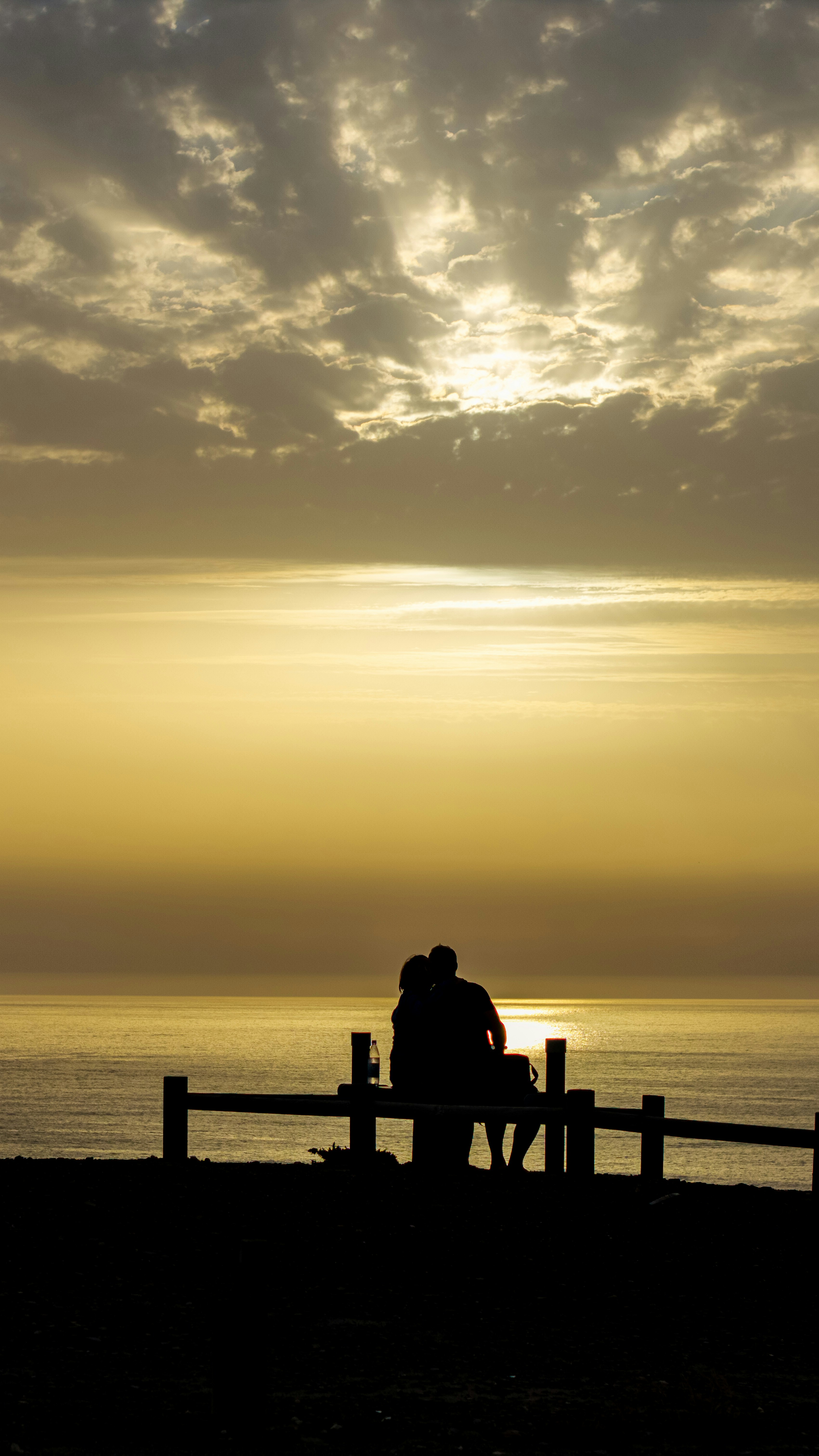 Silhouette at Sunset: A Quiet Moment on the Pier