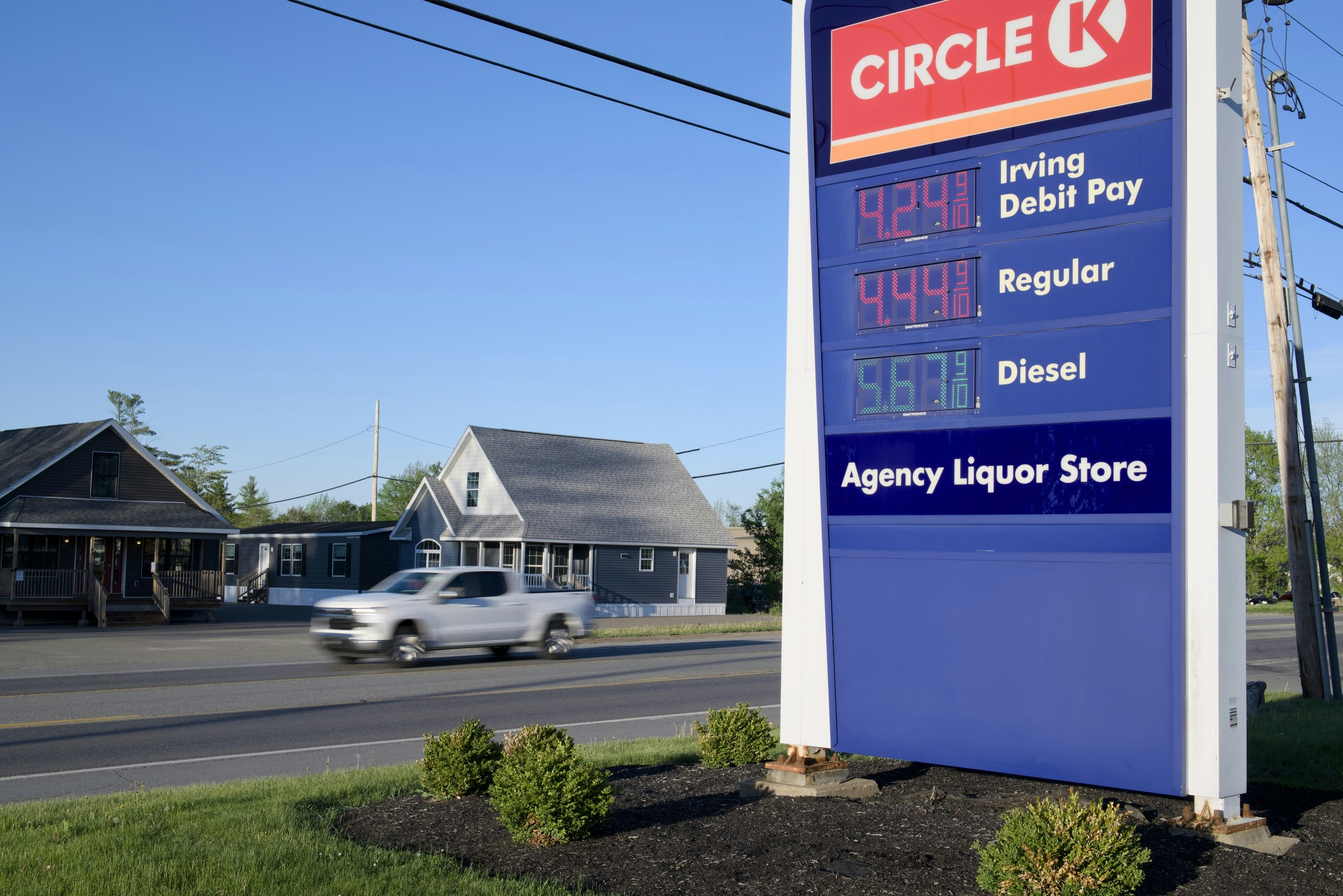 Streetside Gas Station Sign Framing the Quiet Highway