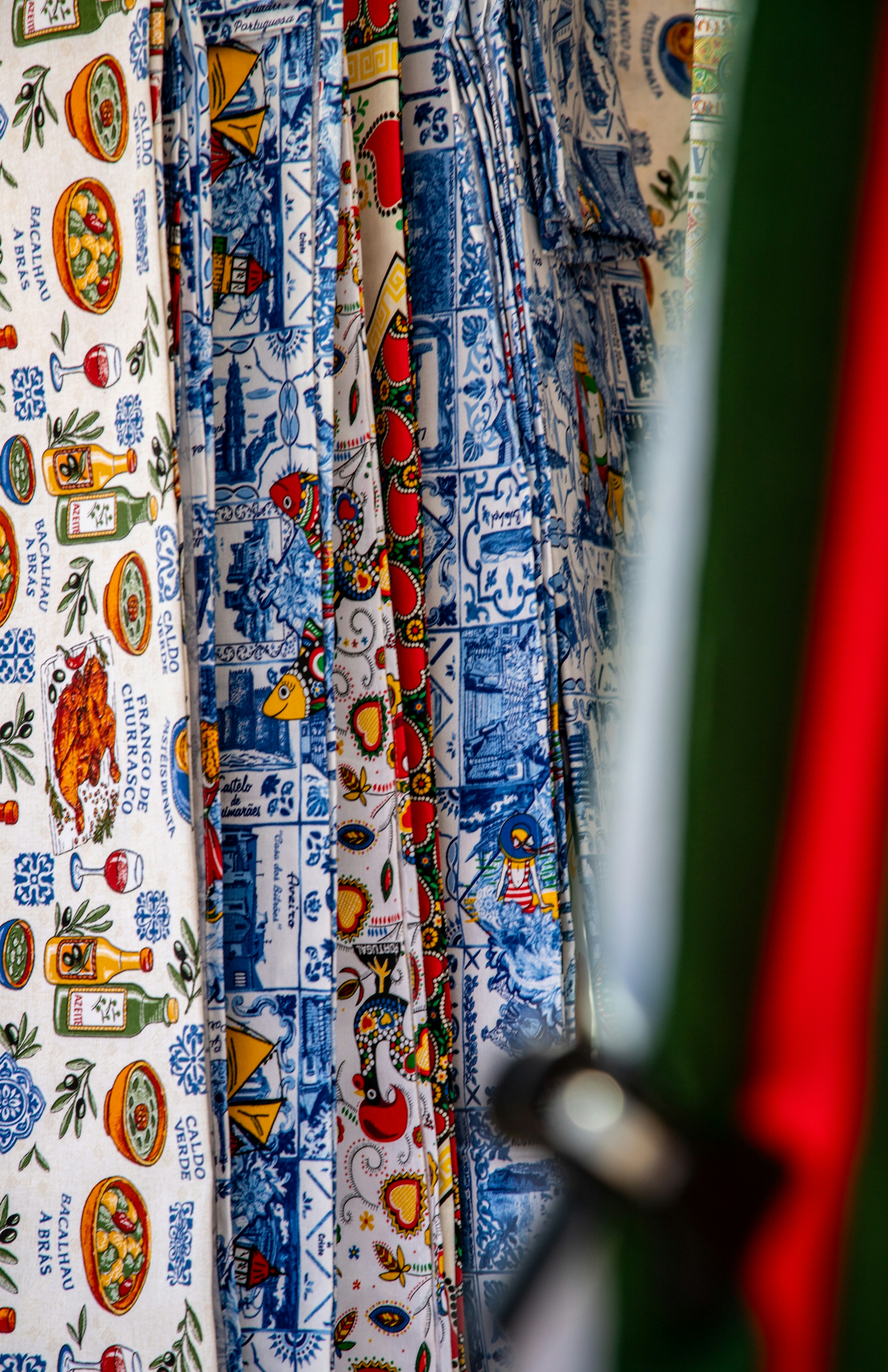 Colorful Fabrics on a Shopping Rack: A Parade of Pattern and Hue