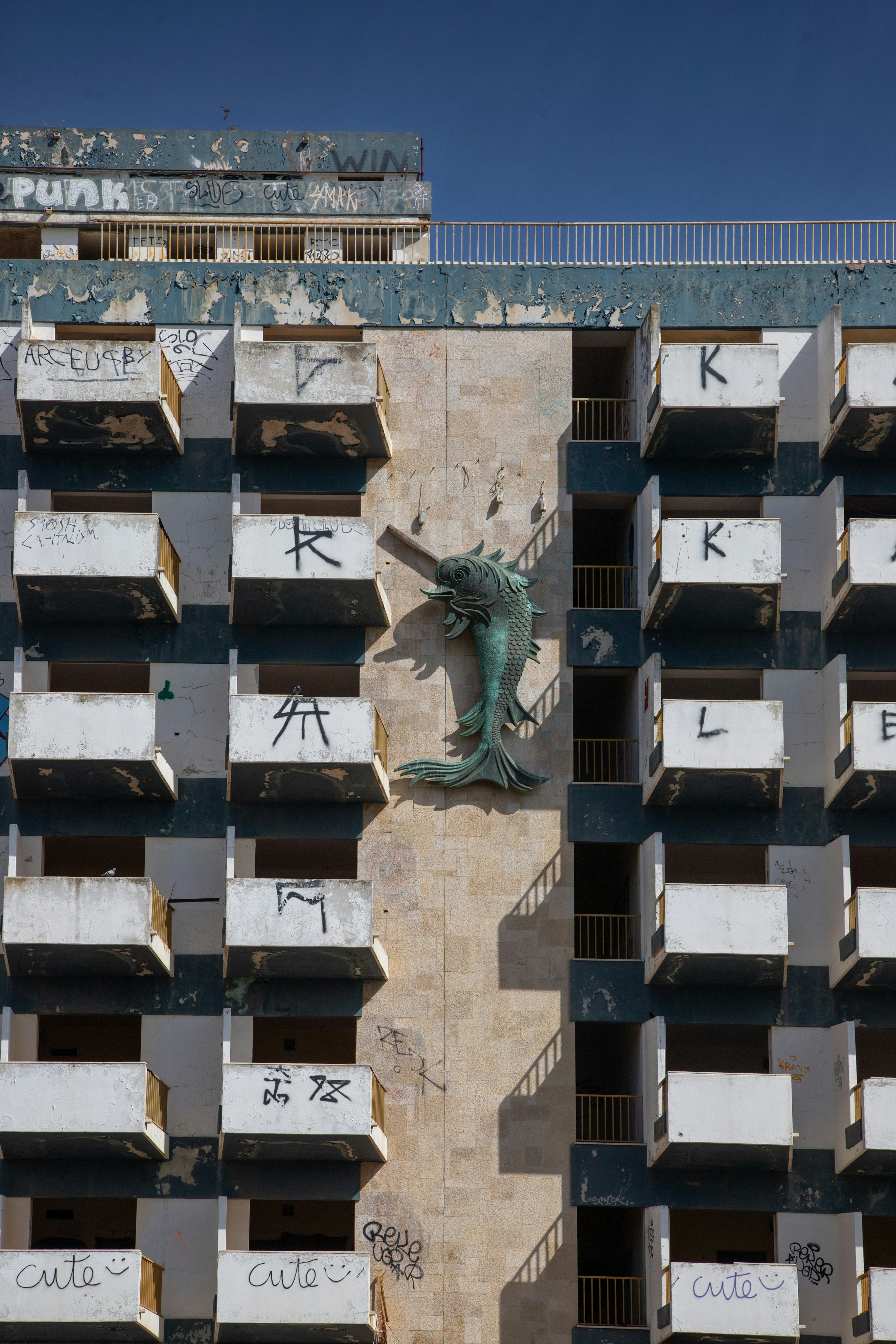 Concrete Facade, Coral Dragon: A Deteriorated Apartment with a Central Sea-Dragon Sculpture