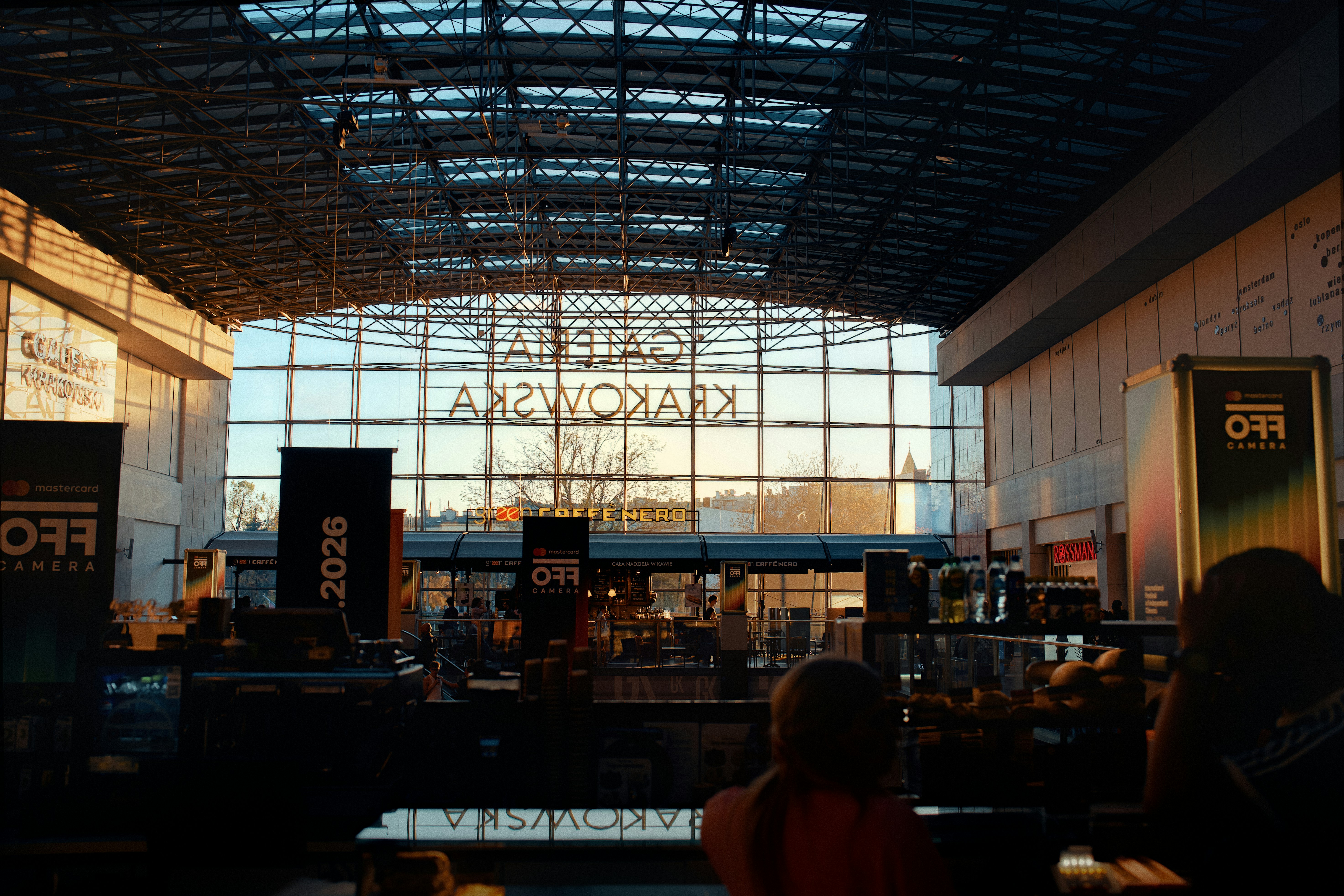 Glass Atrium Echoes: Inside a Dim Morning at the Airport Mall