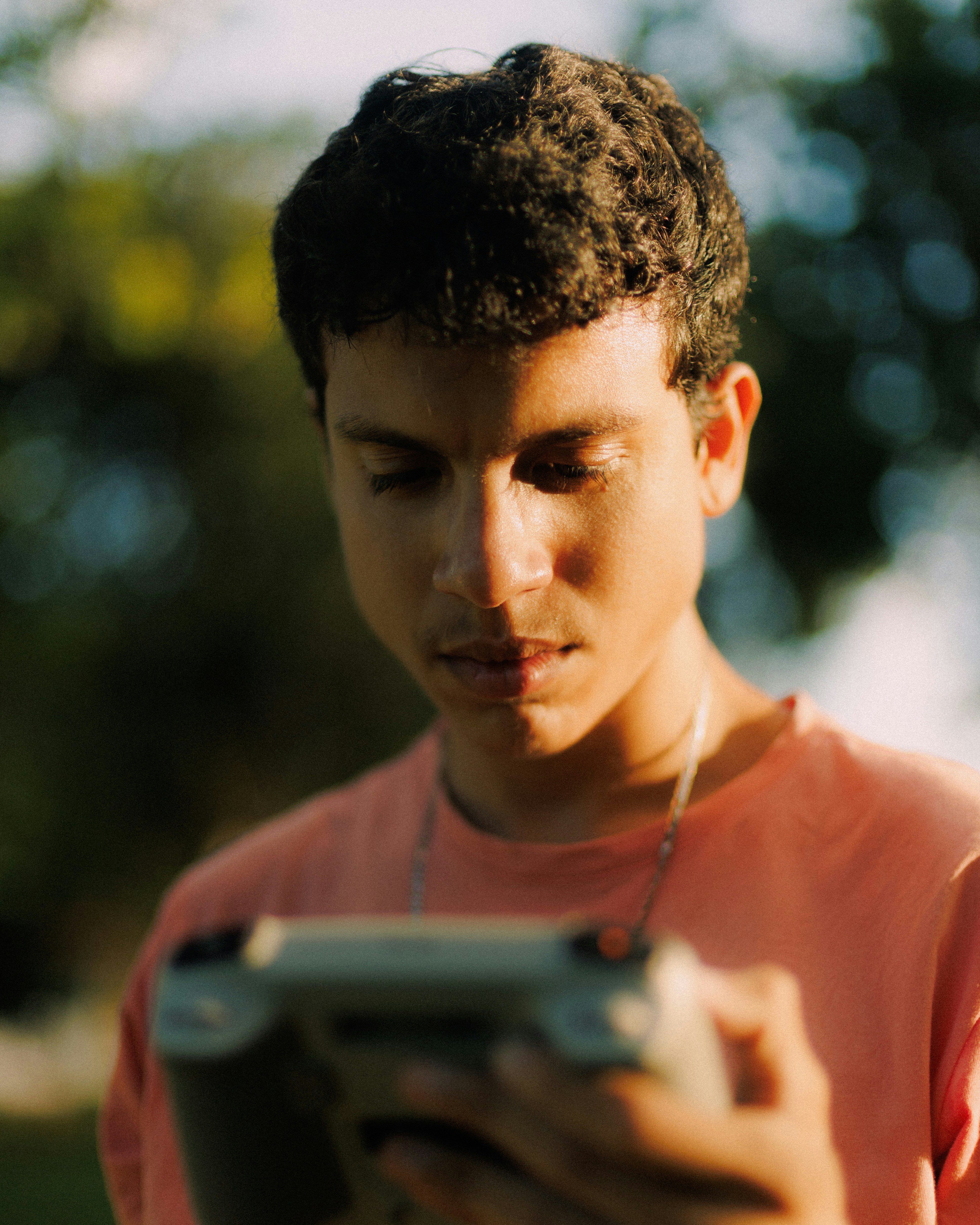 Focused Moment: A Quiet Look Down at a Handheld Device