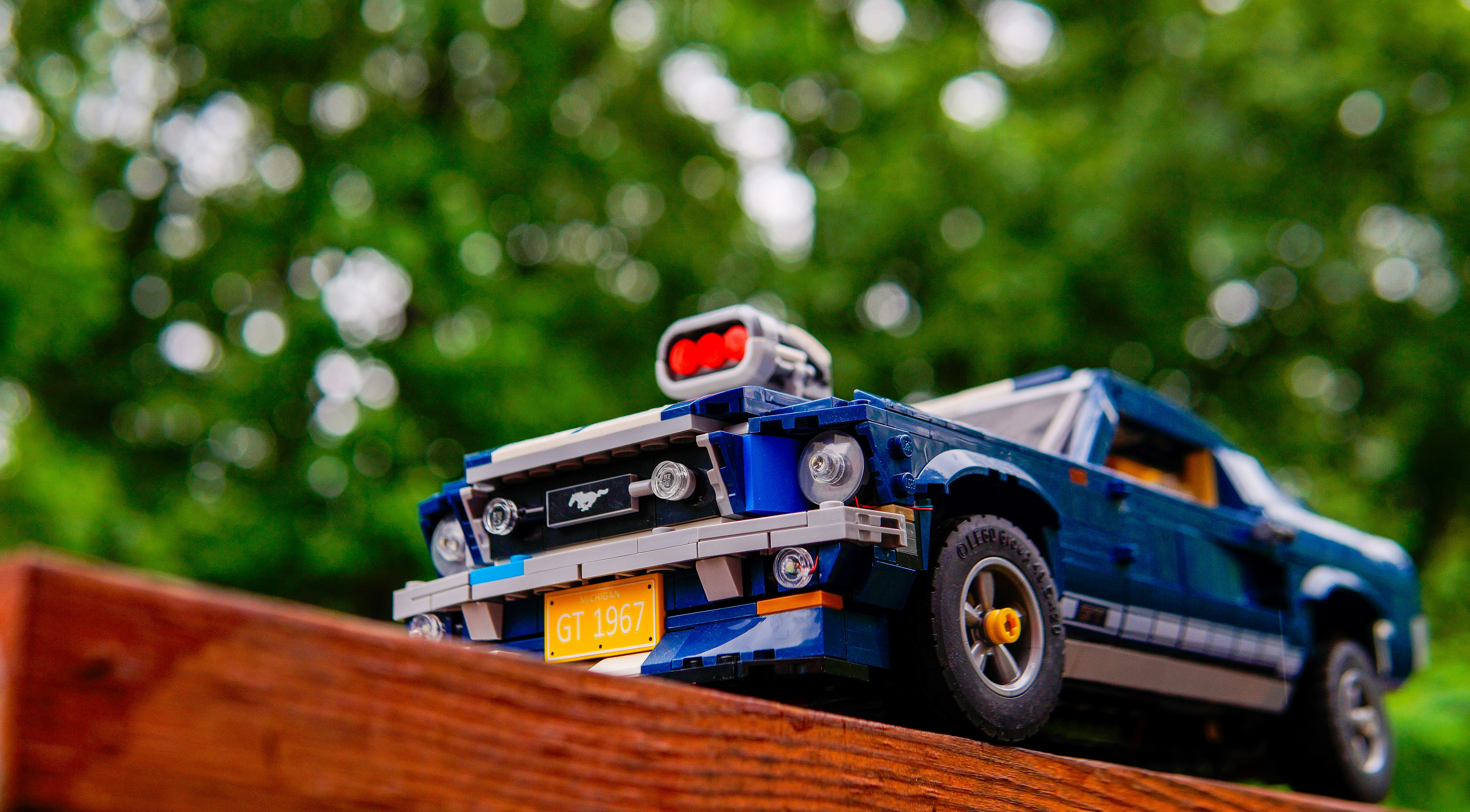 Blue Mega-Toy on a Wooden Ridge