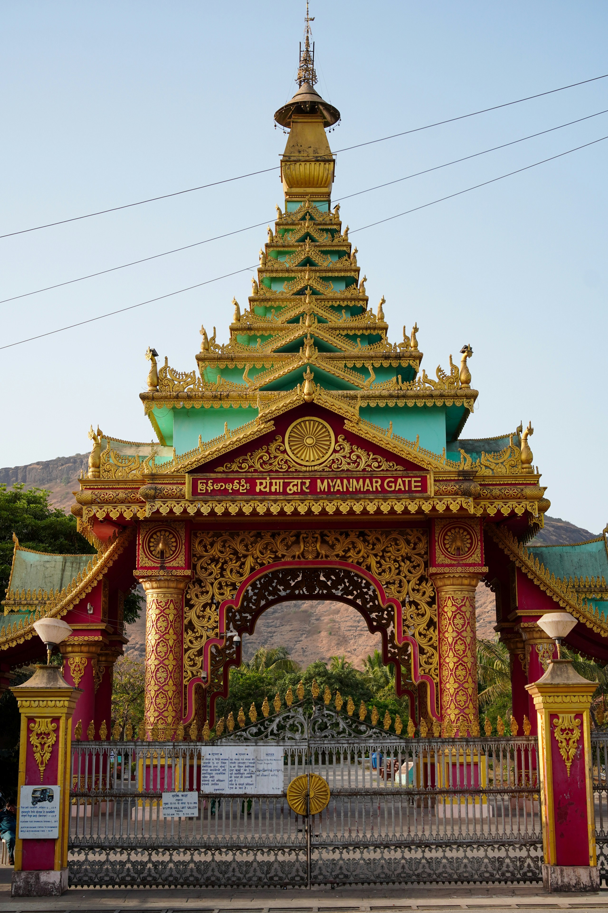 Myanmar Gate: Intricate Amethyst Archway Rising into a Golden Pagoda