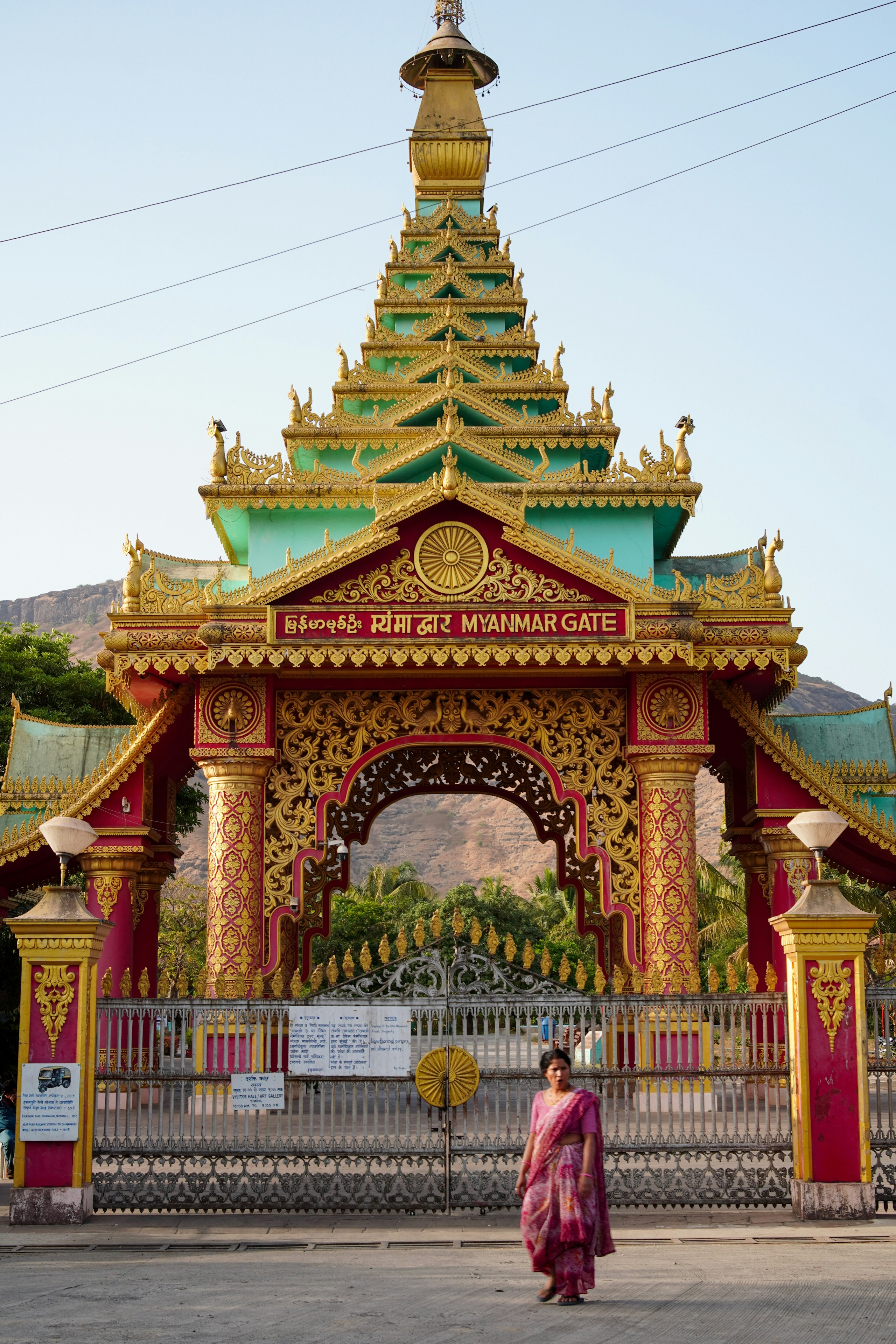 Ornate Myanmar Gate at Dusk: A Temple Entrance Framed by Color and Craft
