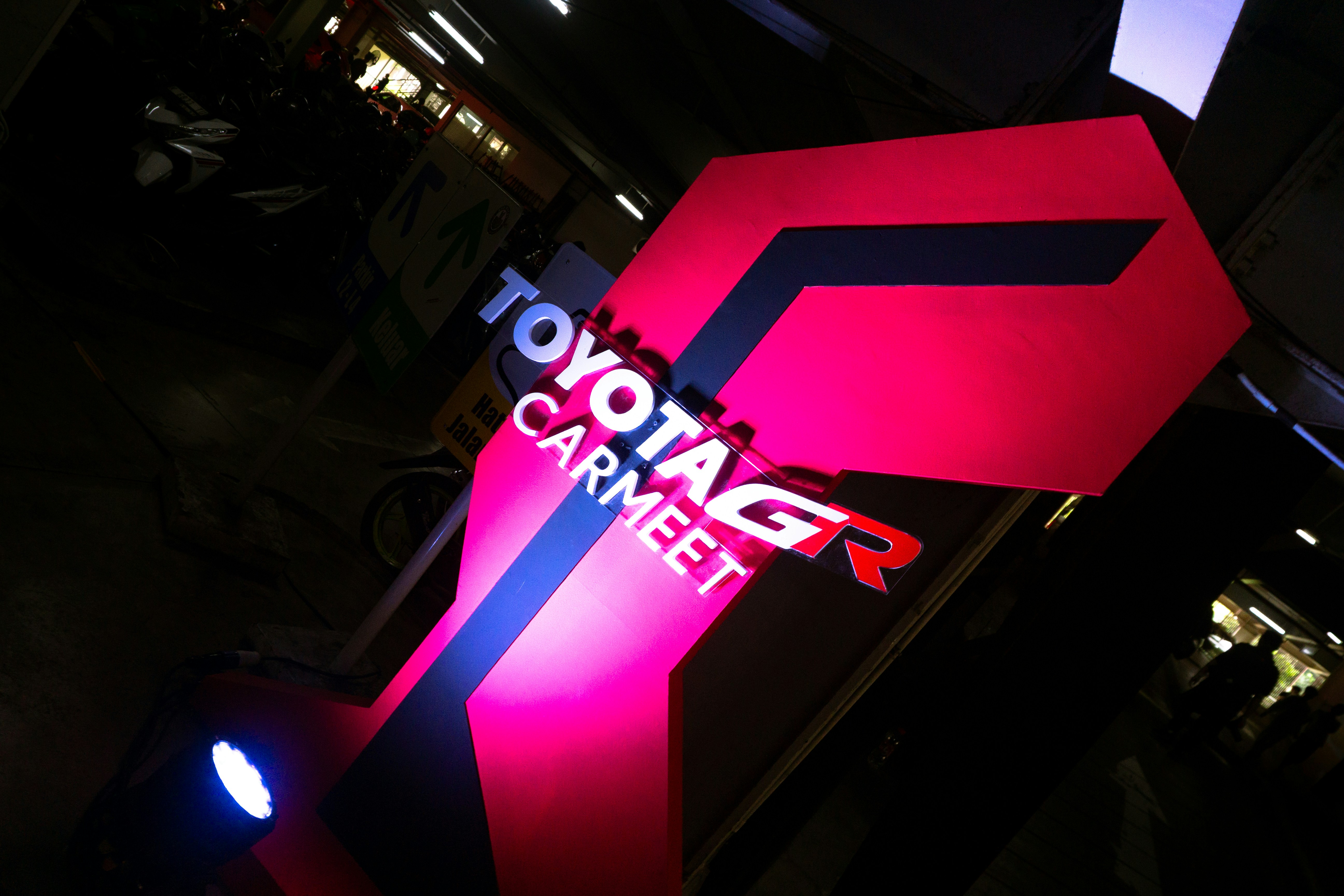 Neon Letterforms at a Toyama Car Meet Entrance