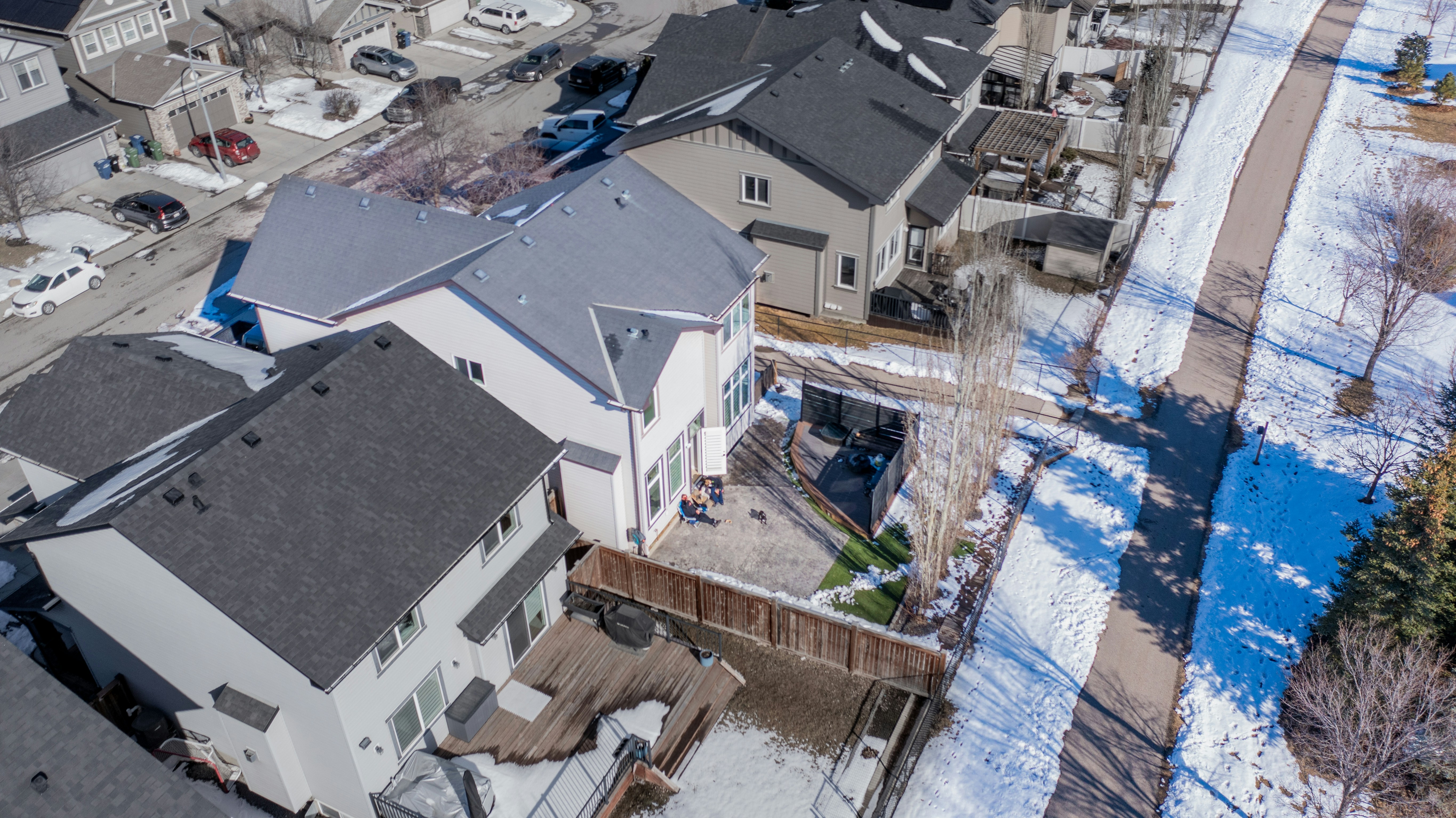 Aerial Snapshot Over Suburban Row Houses with Snow-Cleared Streets