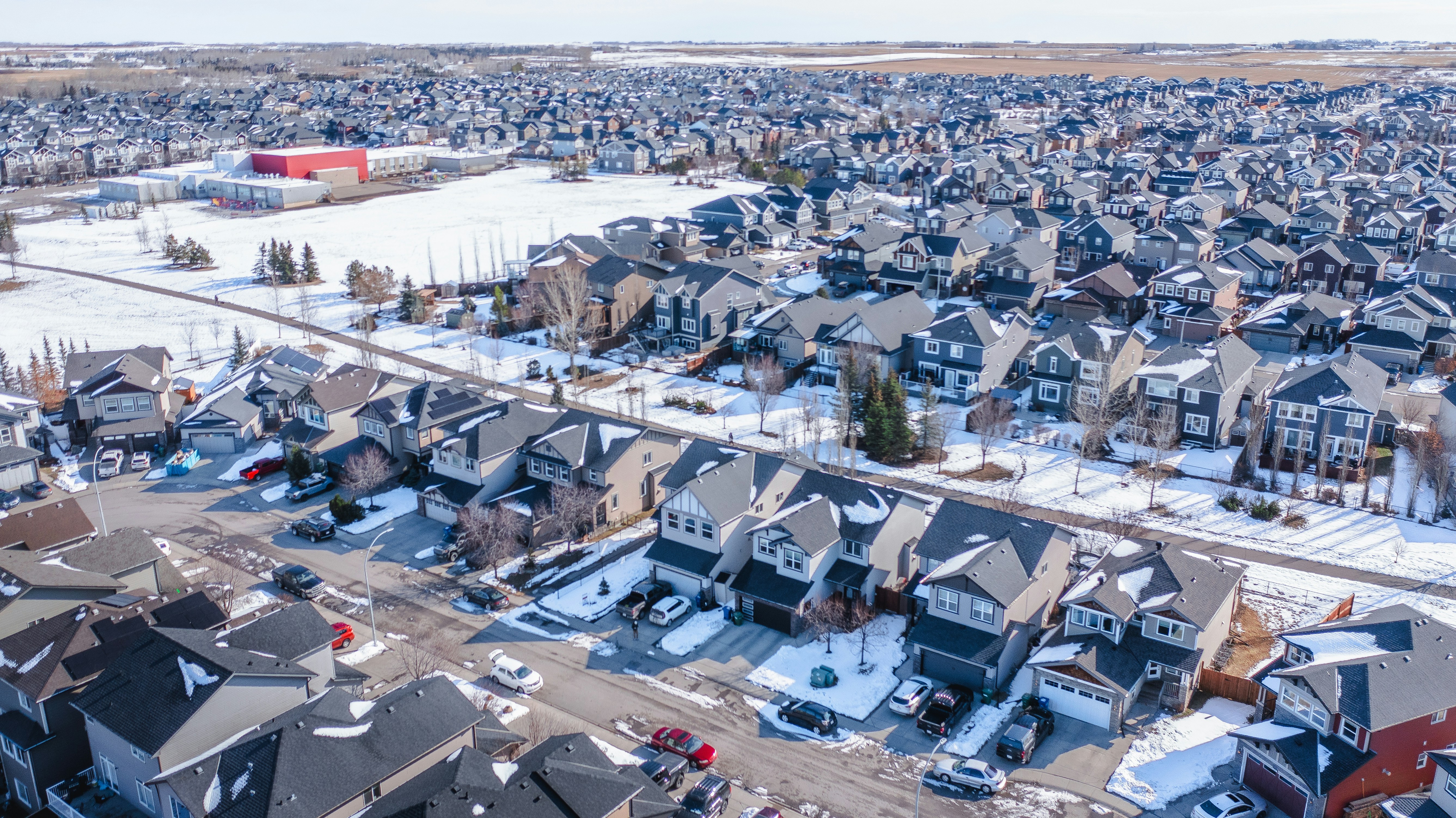 Snow-Covered Suburban Grid Under Winter Light