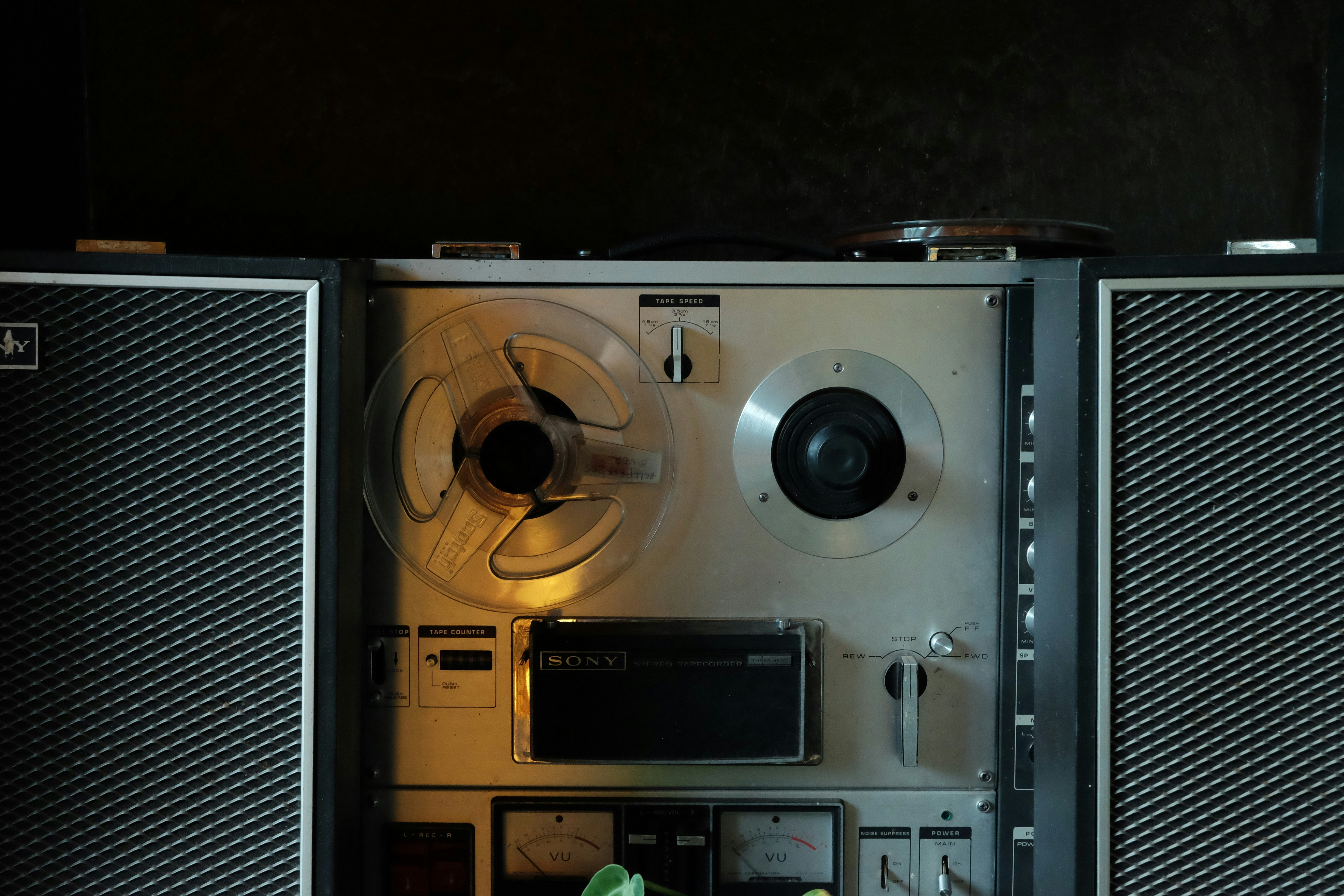 Silenced Studio: A Vintage Tape Recorder Centered Between Gridded Grilles