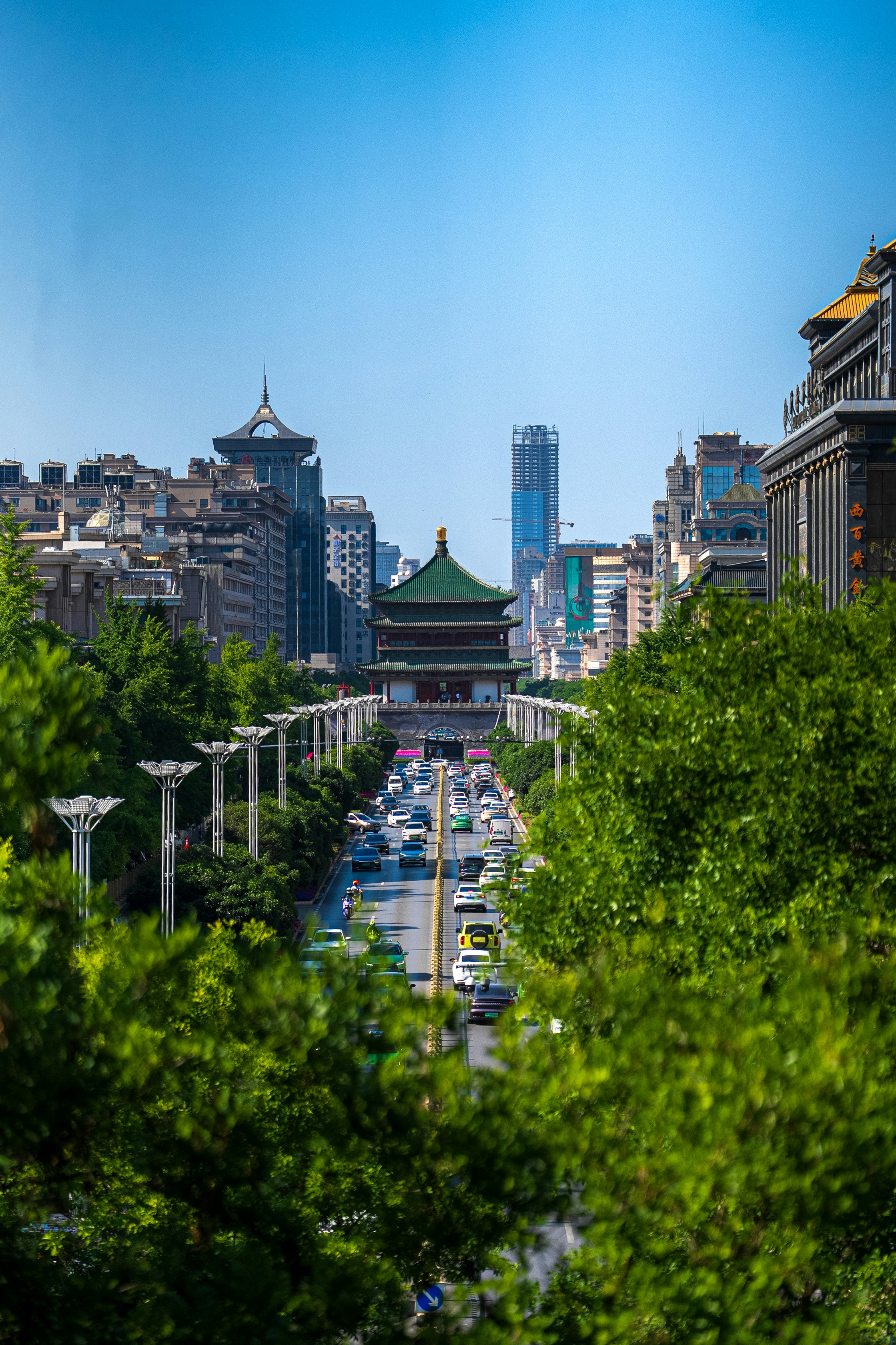 Gate to the City: A Century of Street Life Framing a Traditional Pavilion