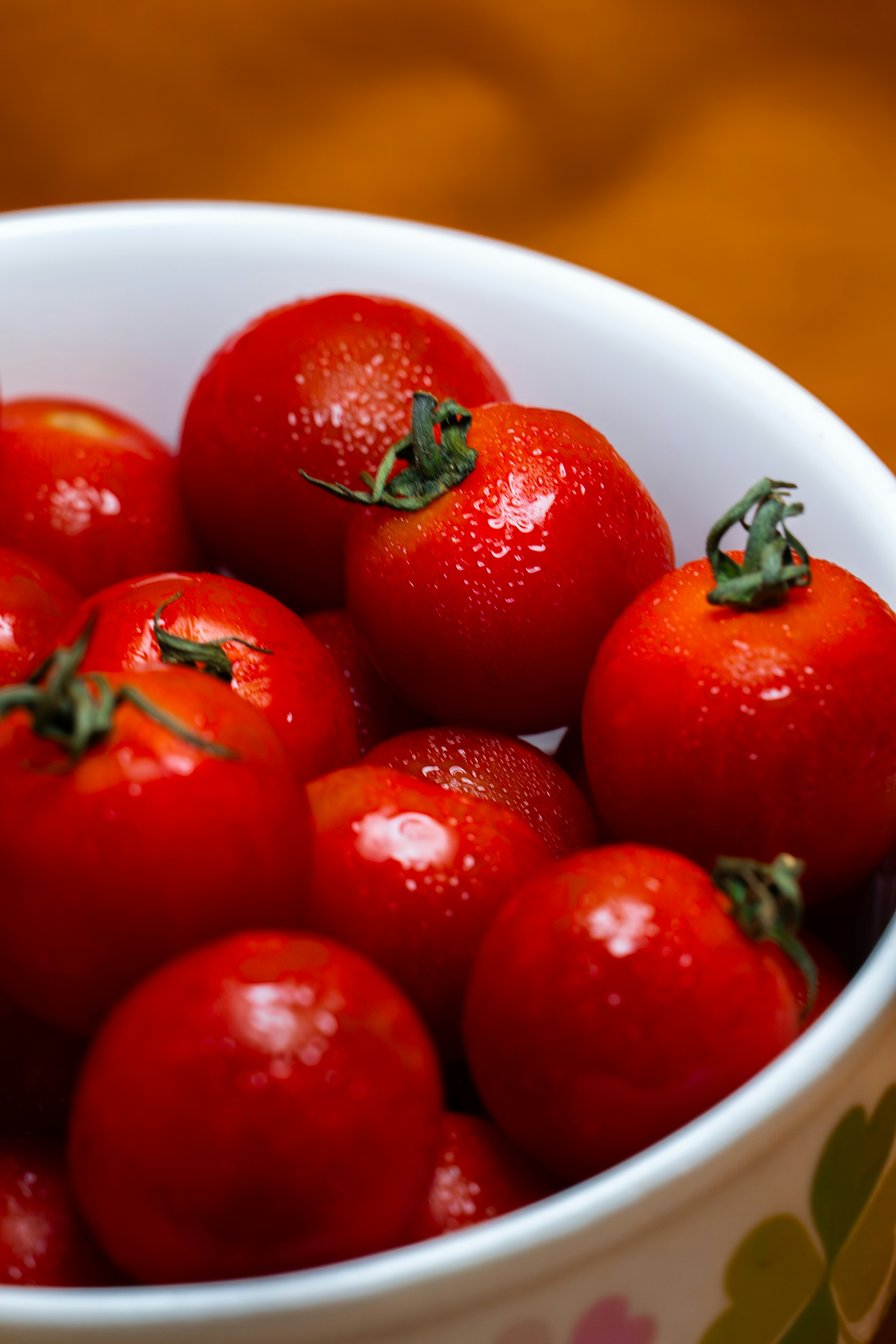 Red Globe Parade in a White Ceramic Bowl
