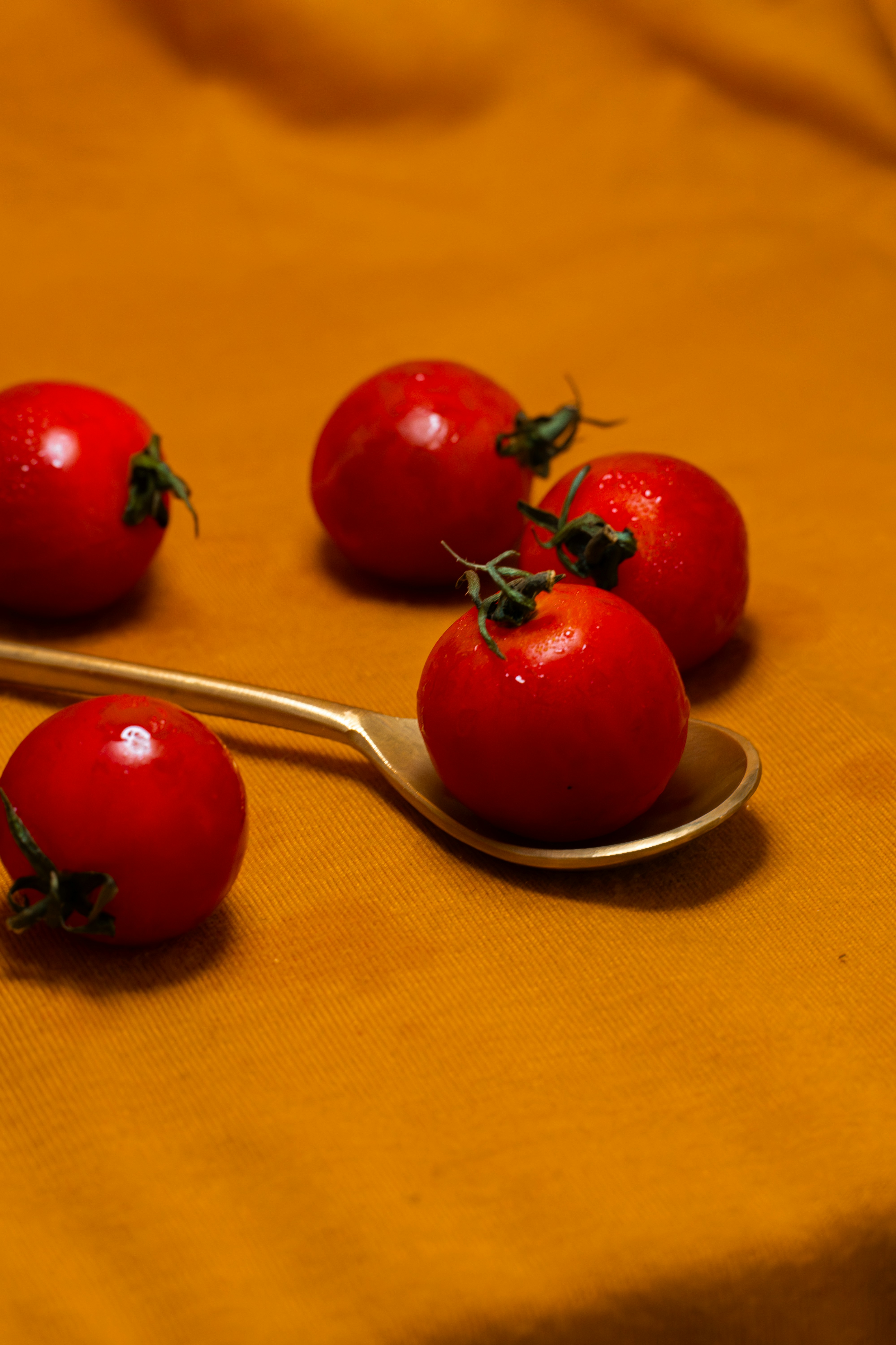 Golden Surface, Red Orbs: A Tasteful Still Life Moment