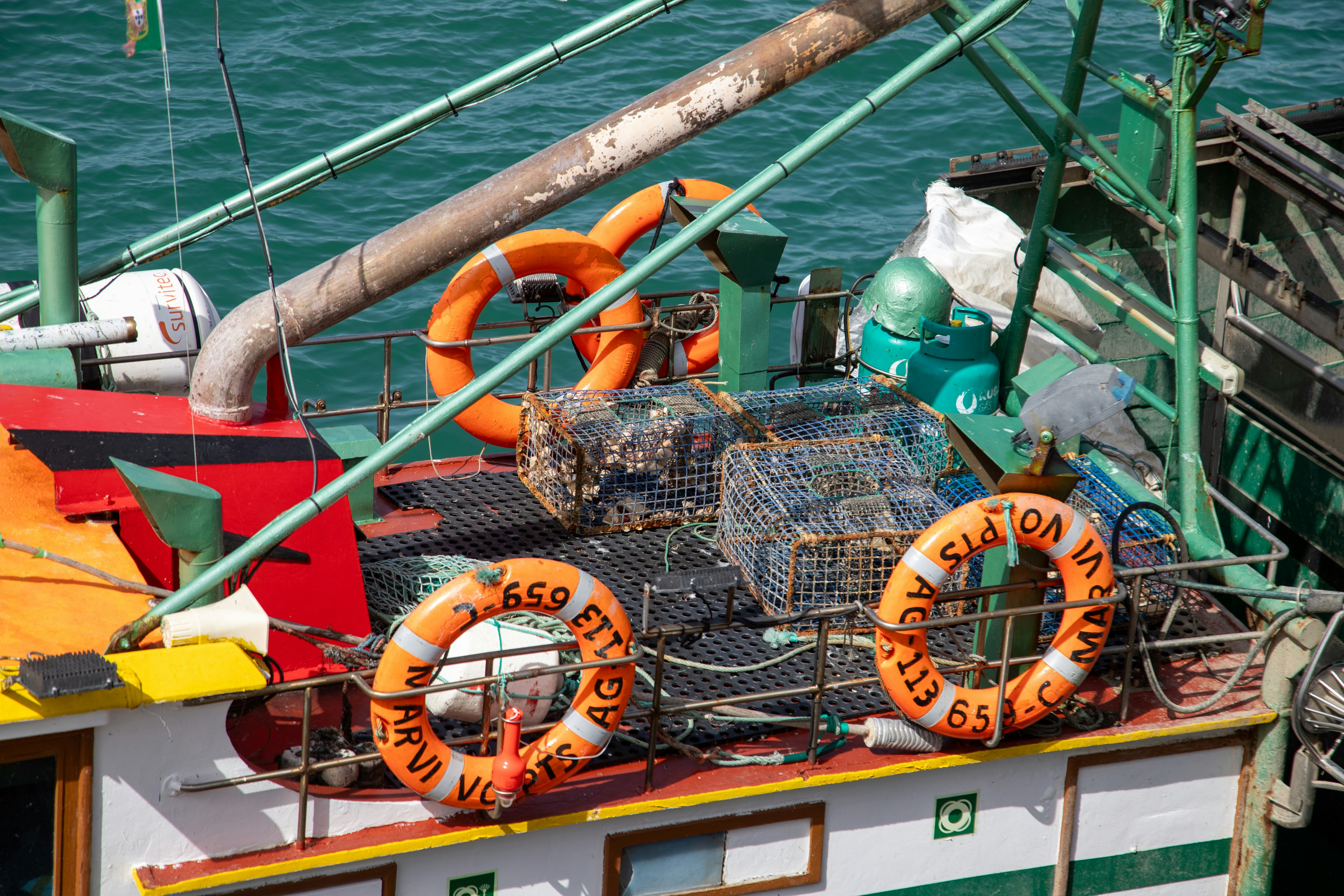 Lifelines at Sea: Orange Rings and Nets on a Fishing Vessel