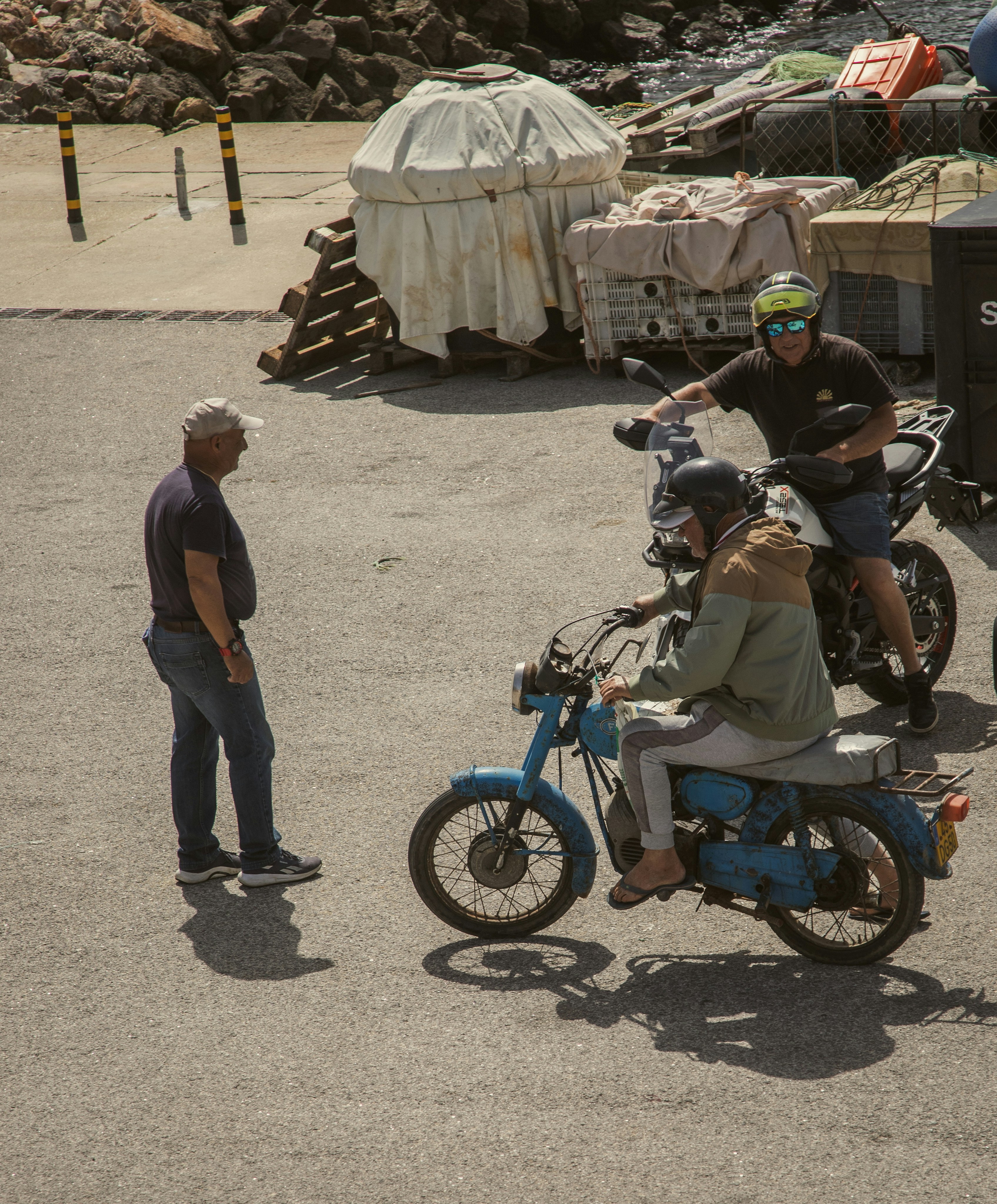 Conversation at the Wharf: Man in Purple Jeans and Two Motorcycles