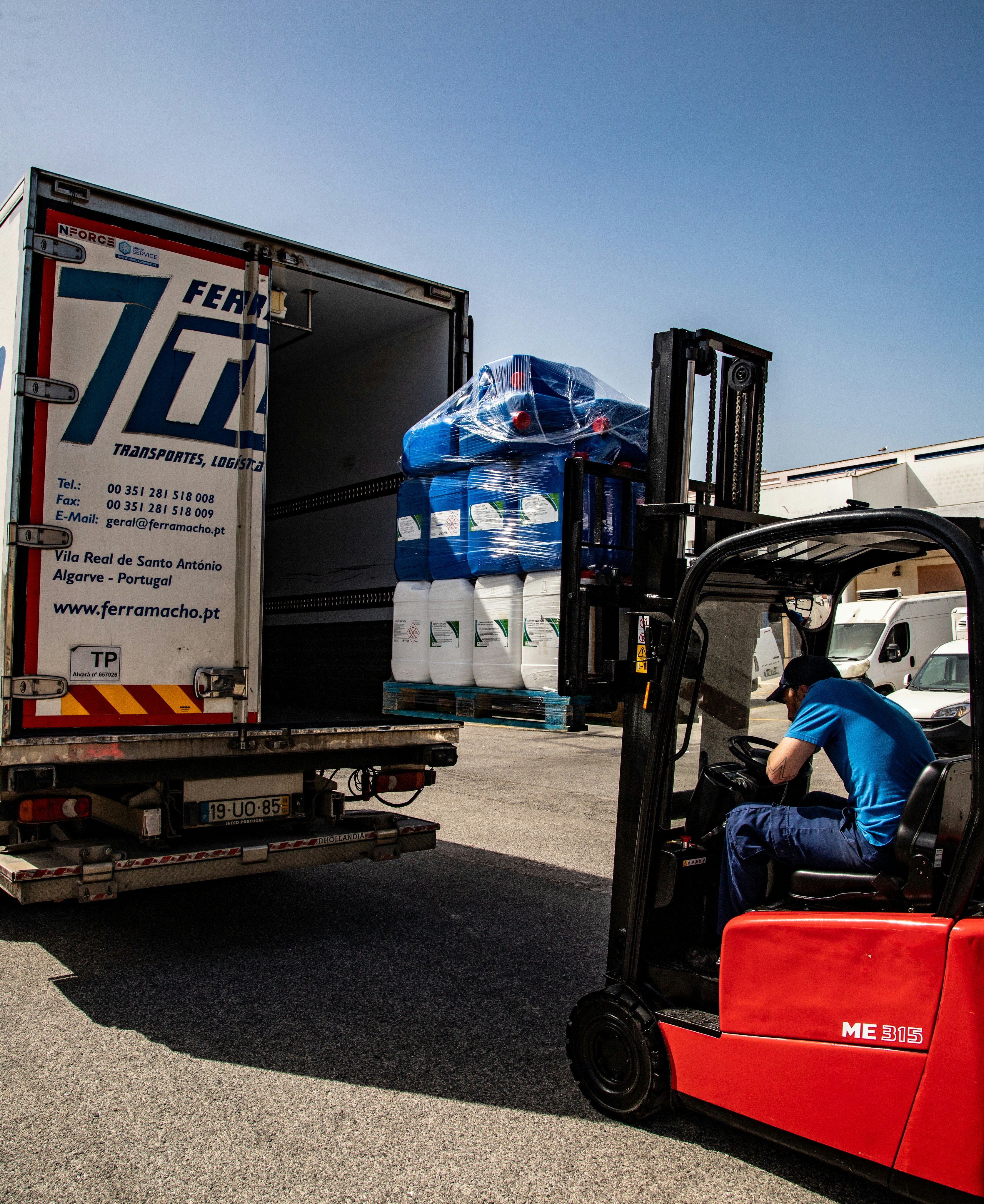 Logistics in Motion: Pallets Await as a Forklift Rises to the Challenge