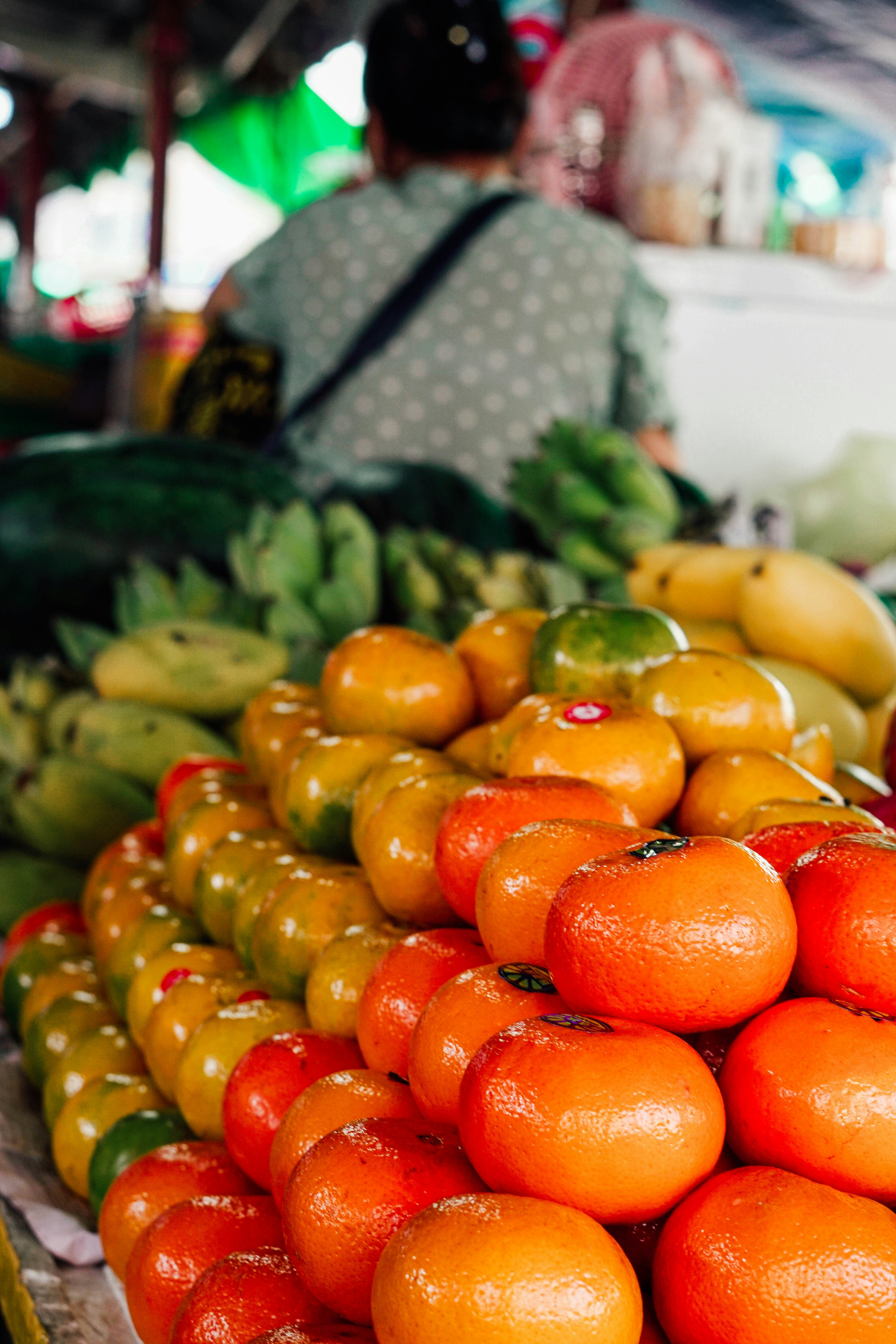 Vibrant Citrus Row at a Bustling Market Stall