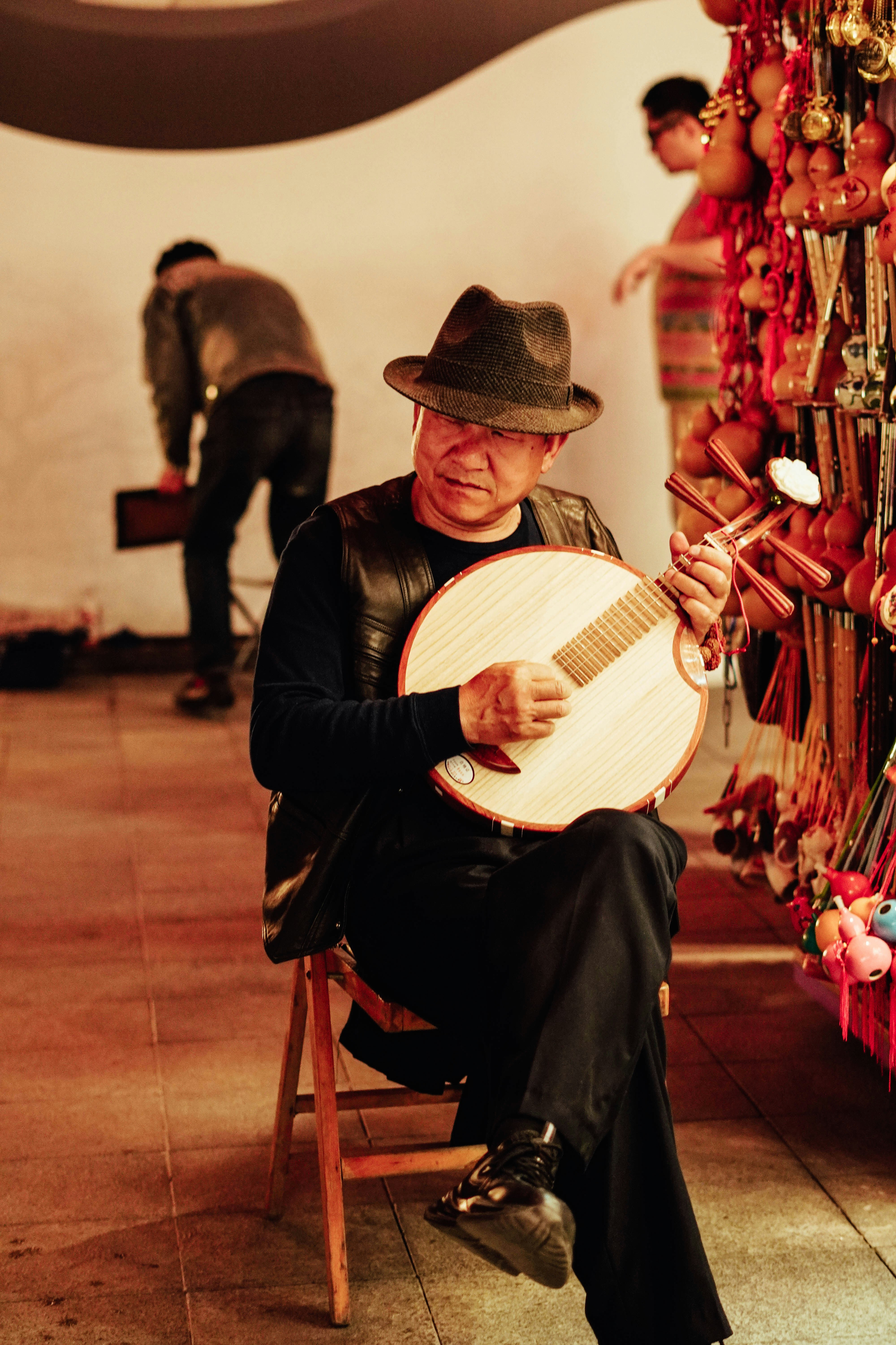 Midday Serenade: A Lute Player in a Market of Colors