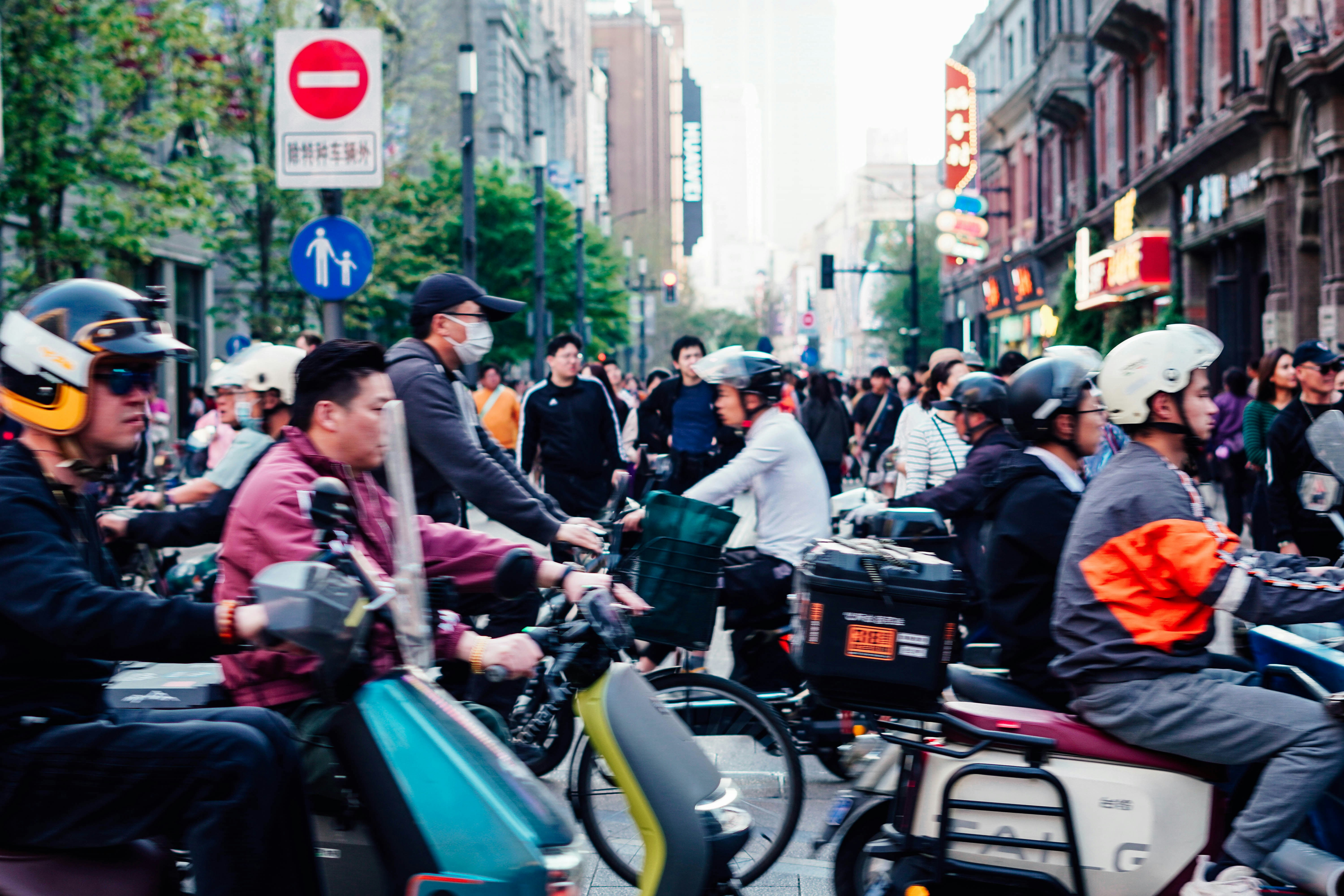 City Chorus: A Sea of Scooters under Neon Signs