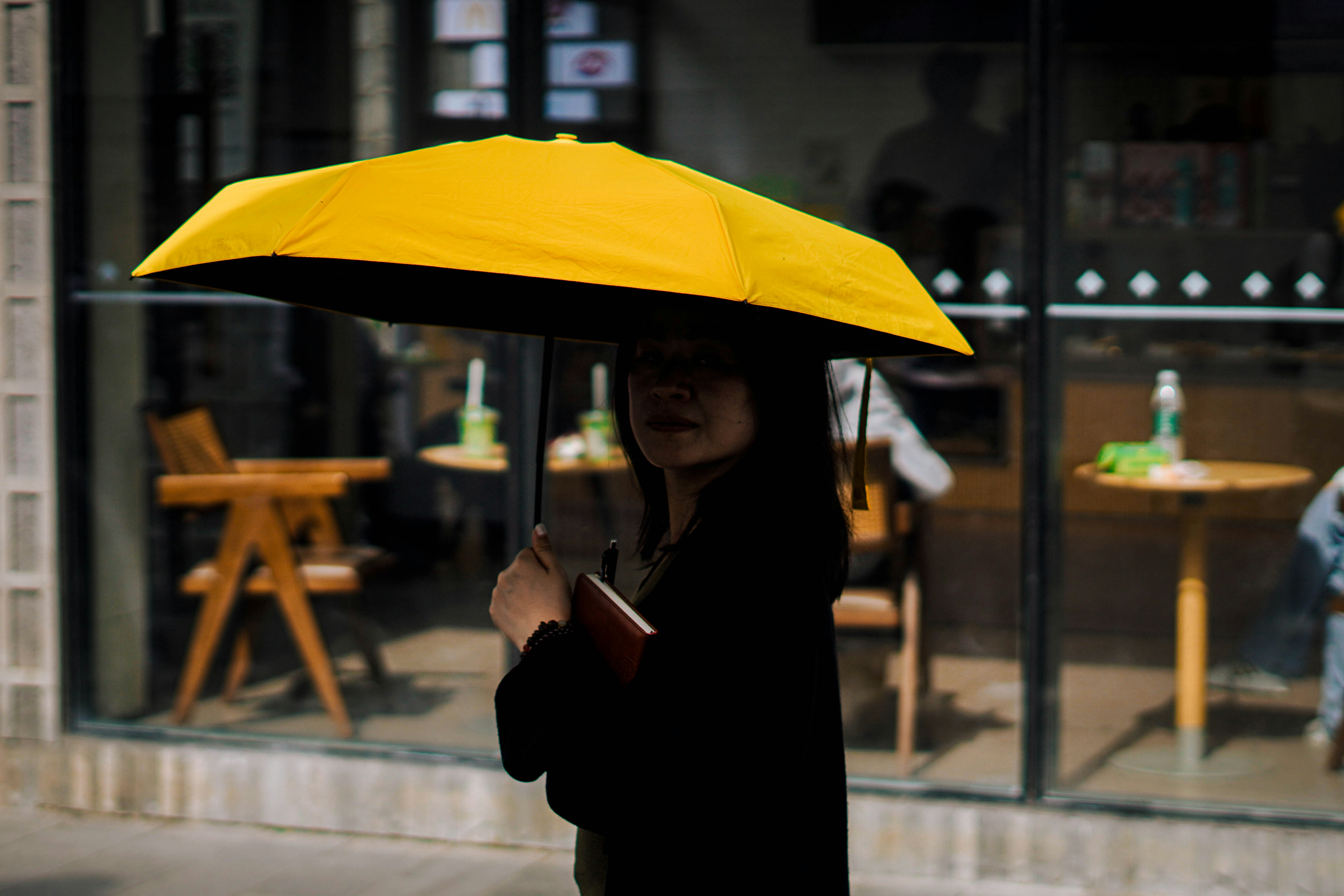Yellow Umbrella, Quiet Moment in the cafe-front Rain