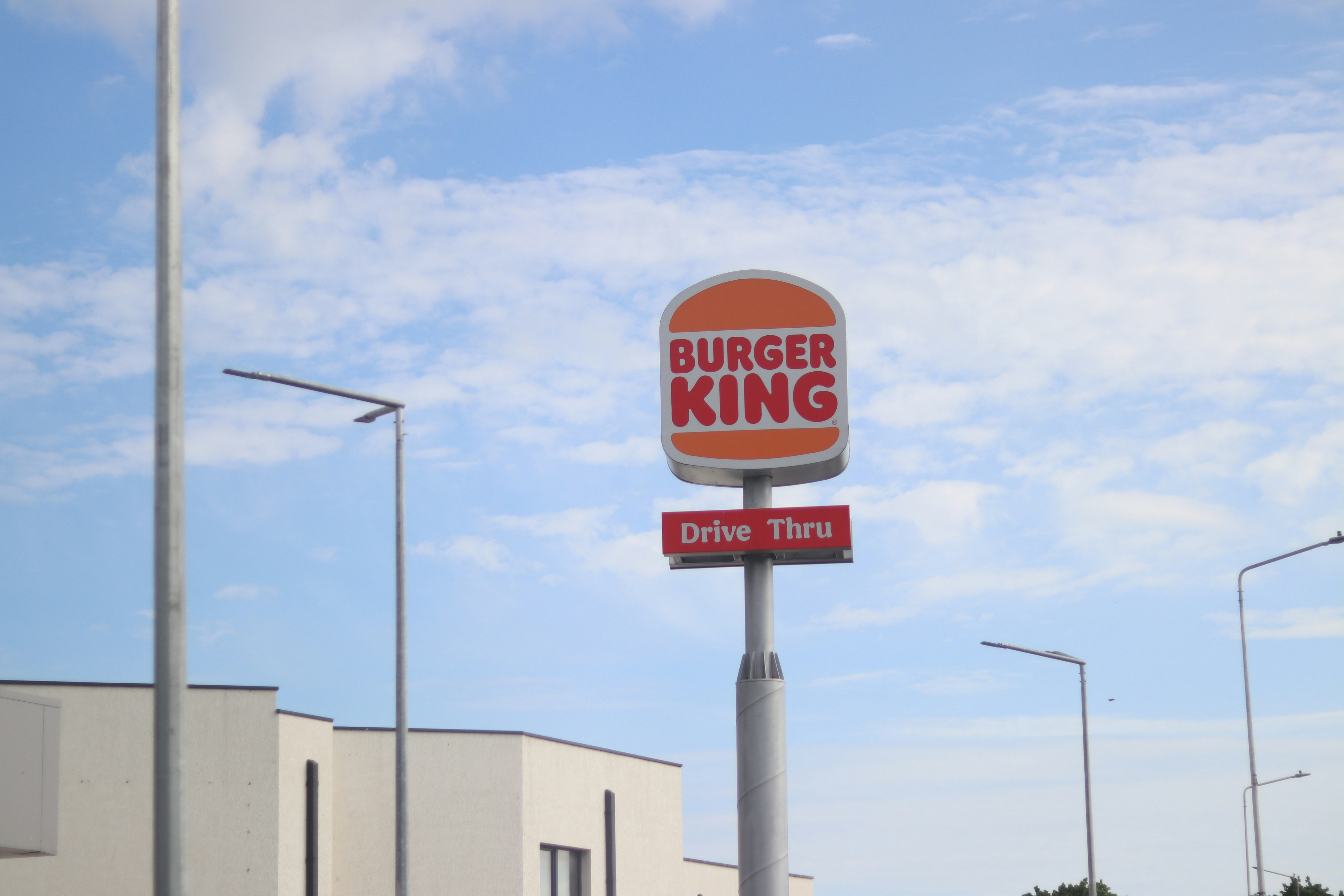 Burger King Drive-Thru Sign Against a Clear Blue Sky