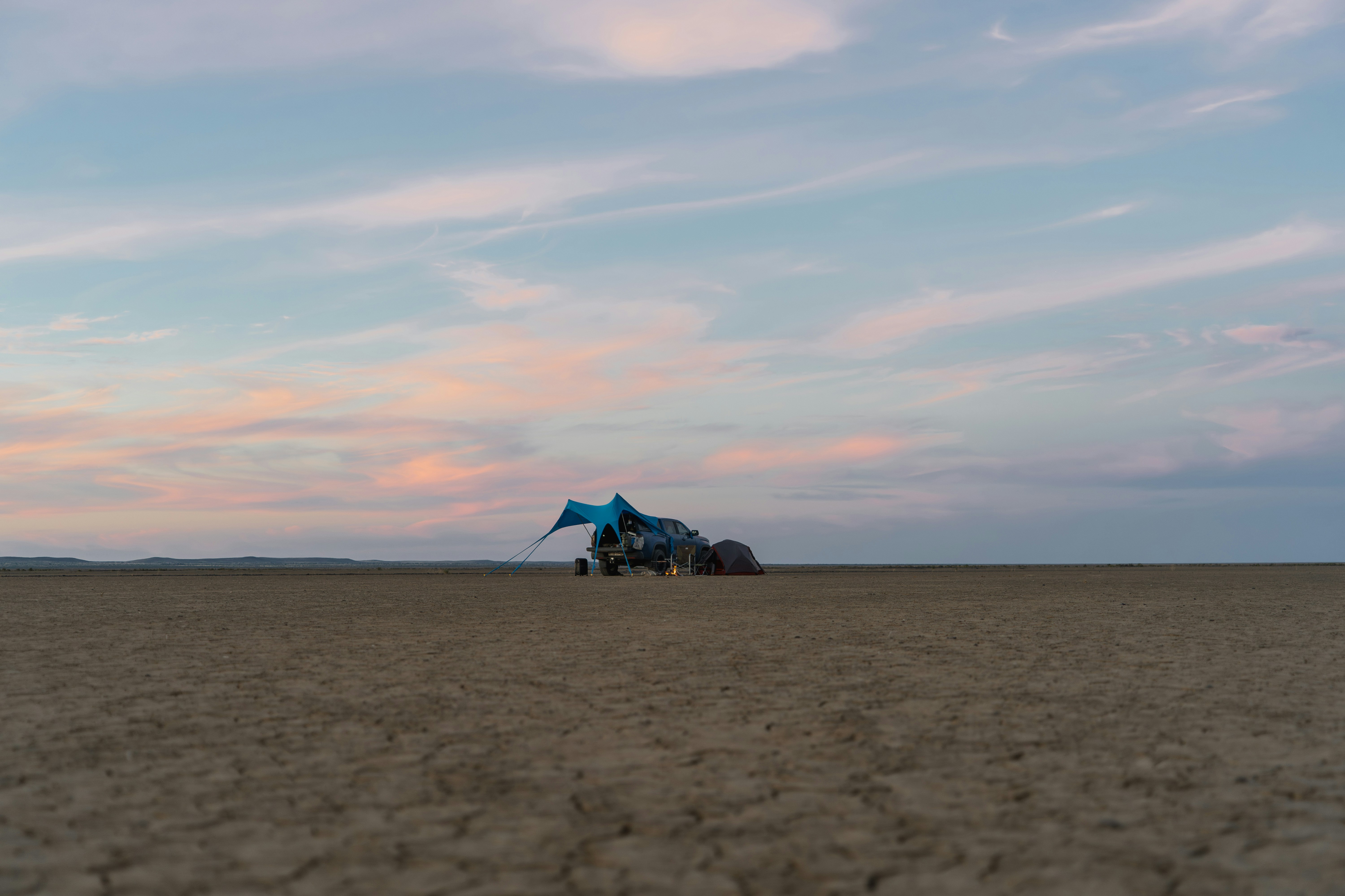 Tent in a Desert Horizon: A Quiet Camp under a Painted Sky