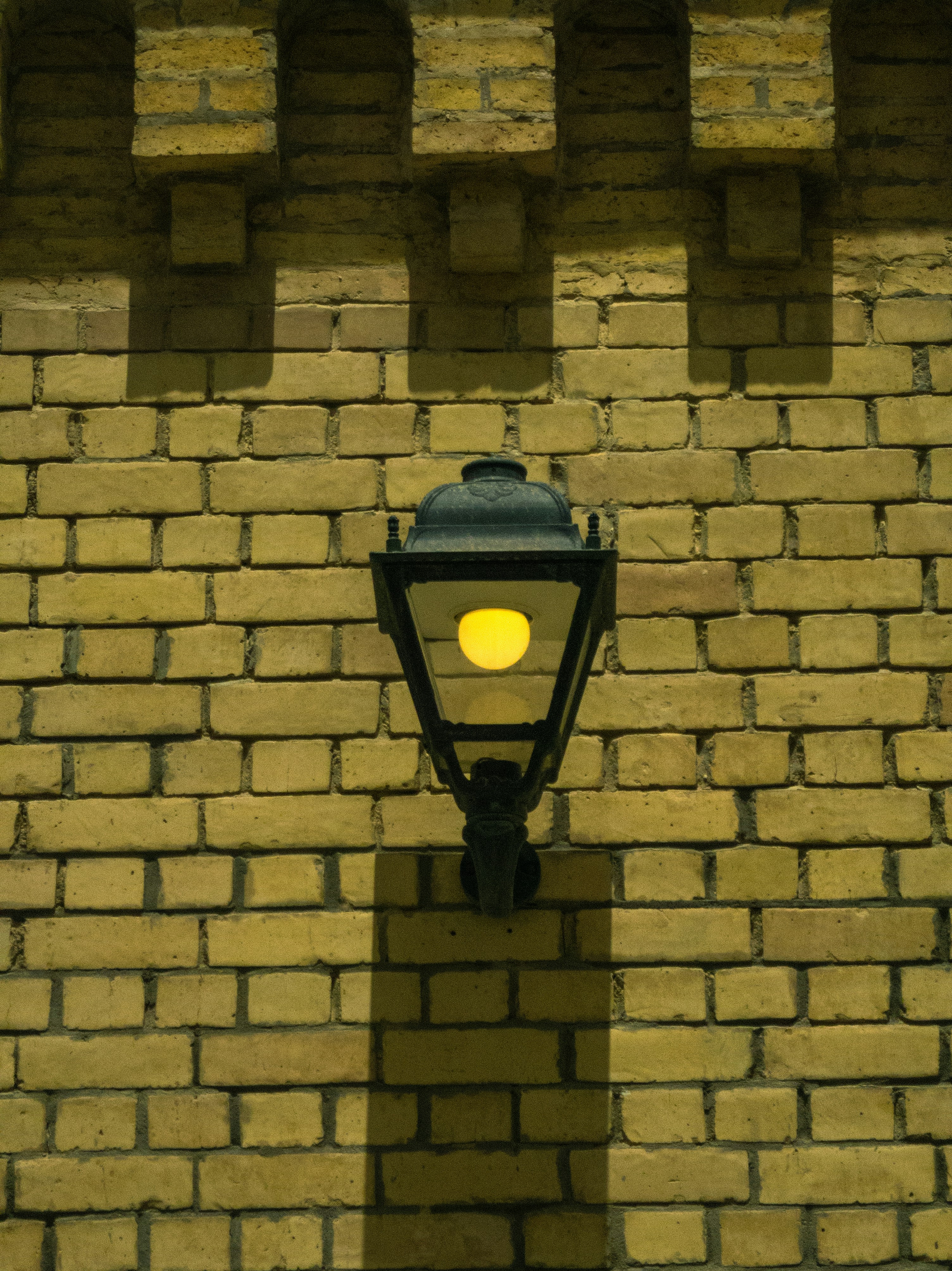 Lantern on a Gilded Brick Wall