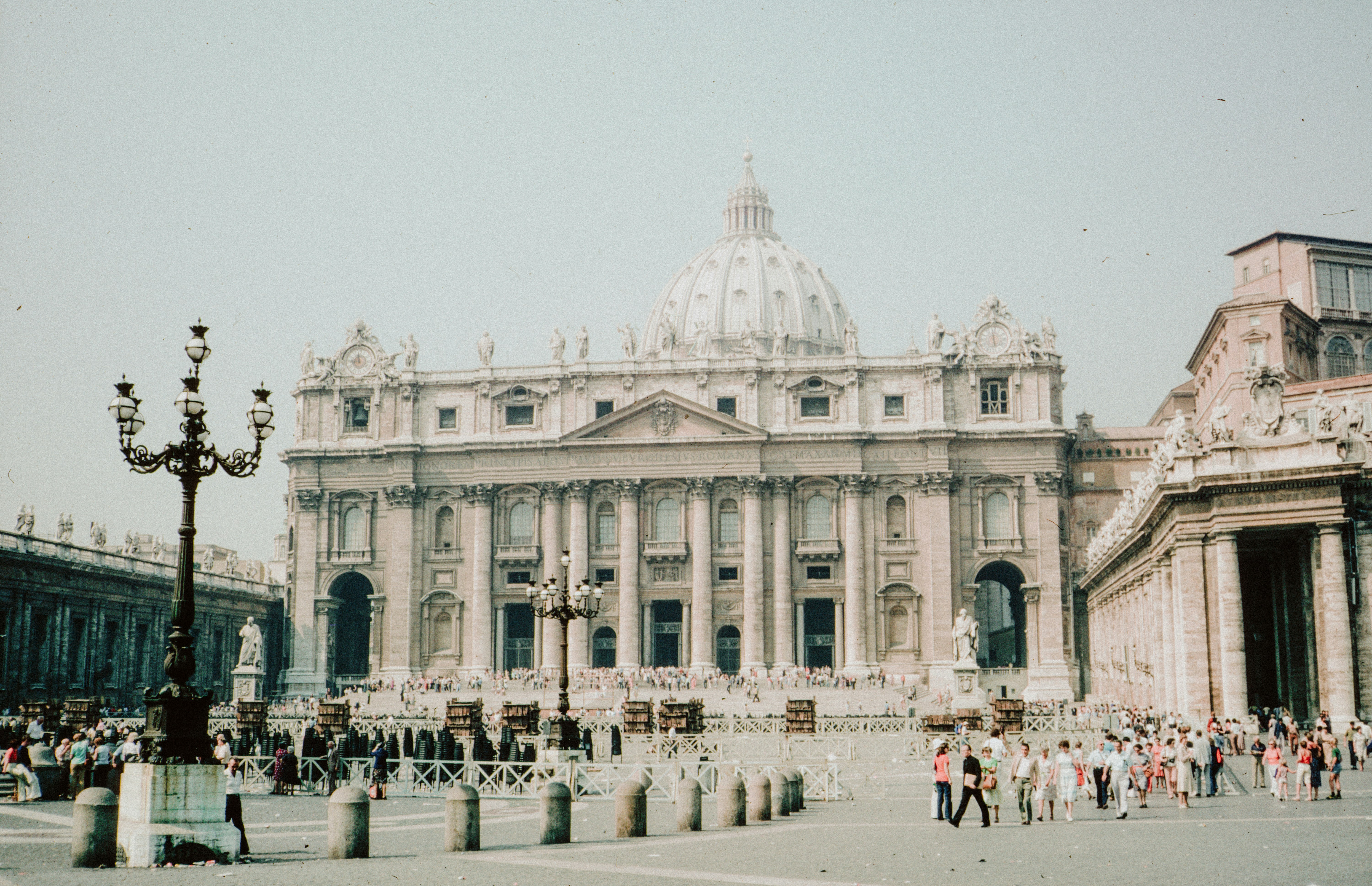 St. peter's basilica in vatican city with people.