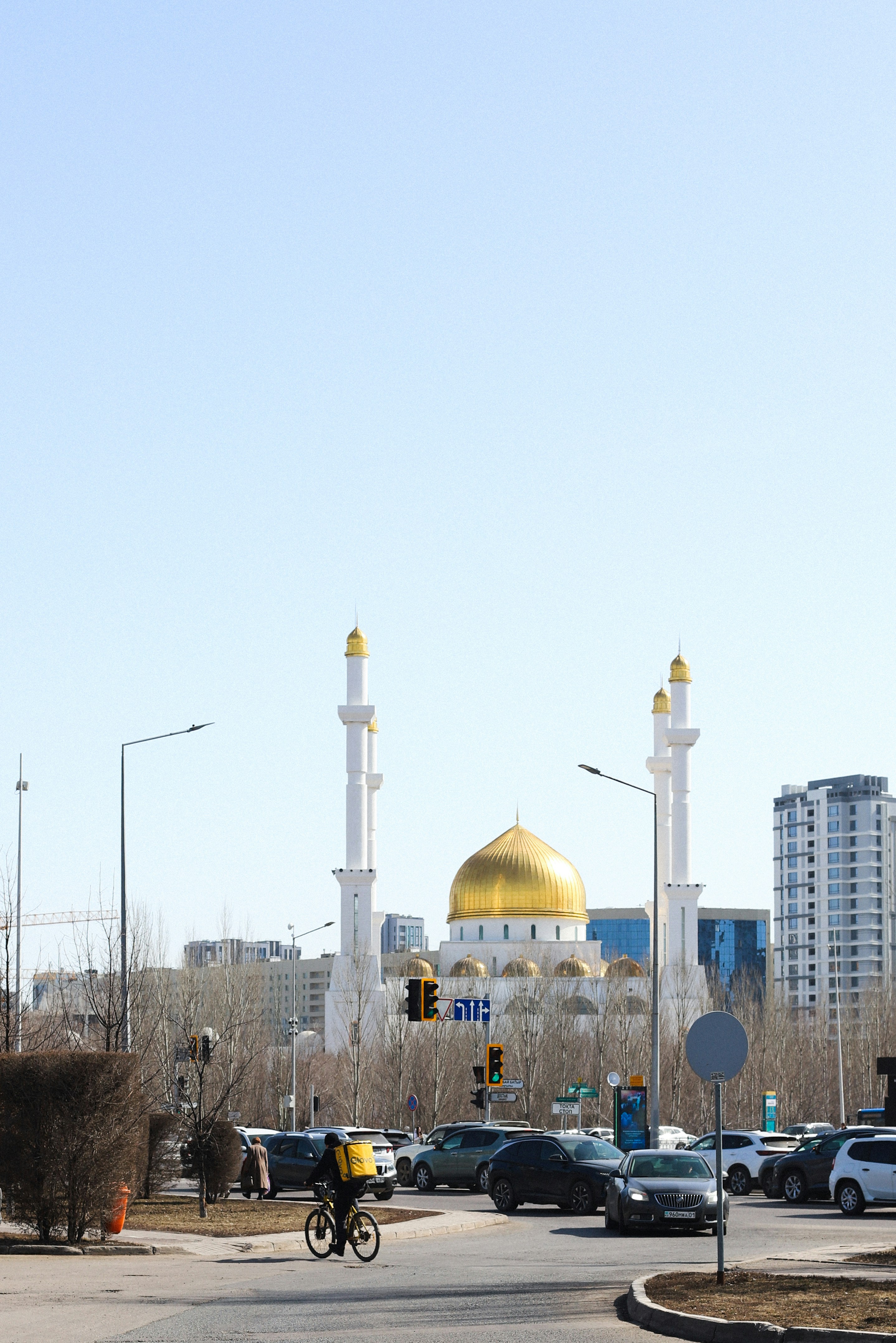 Golden Dome, White Minarets: Urban Mosque Amid Modern Skyline