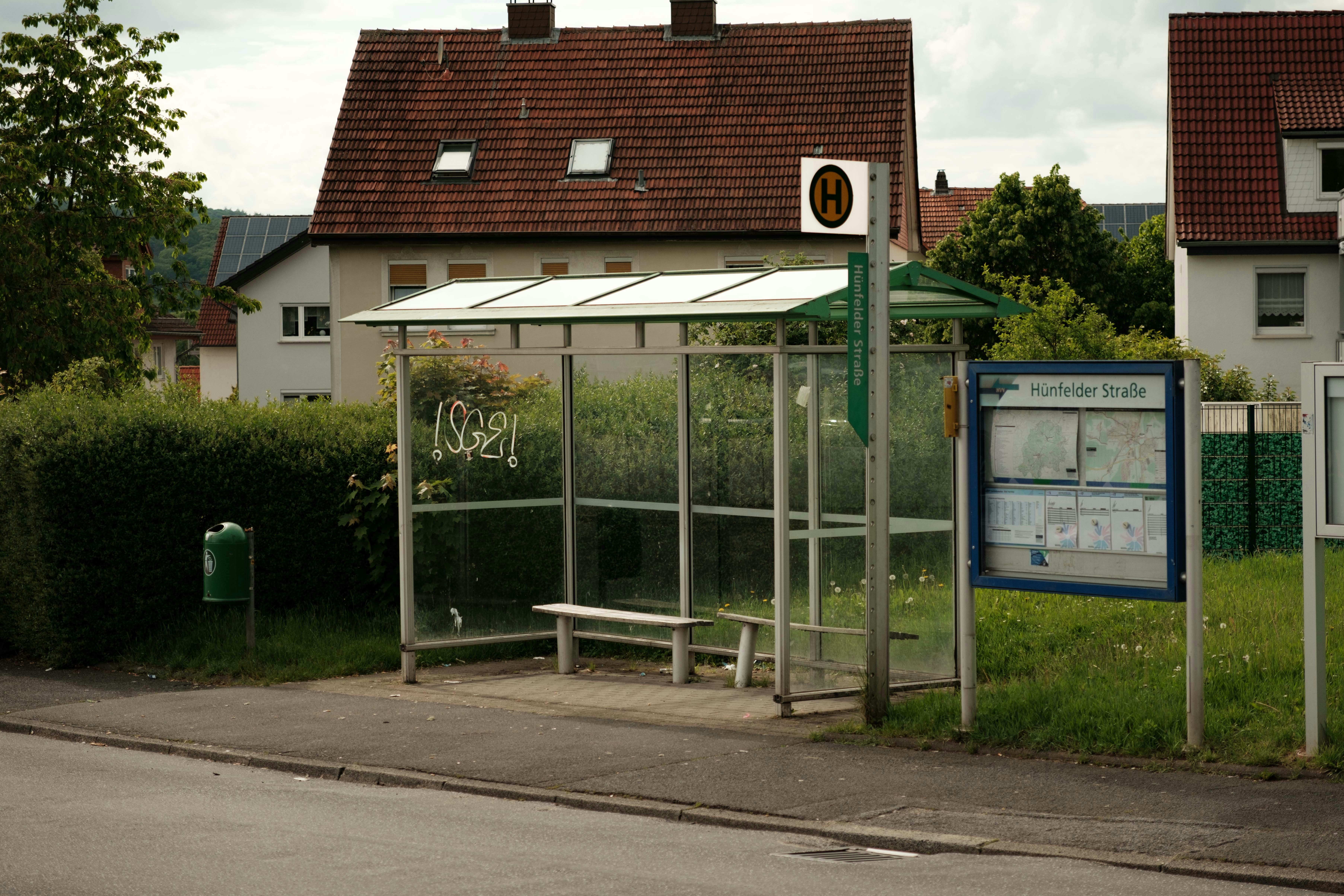 Quiet Suburban Bus Stop Sheltered in Morning Light
