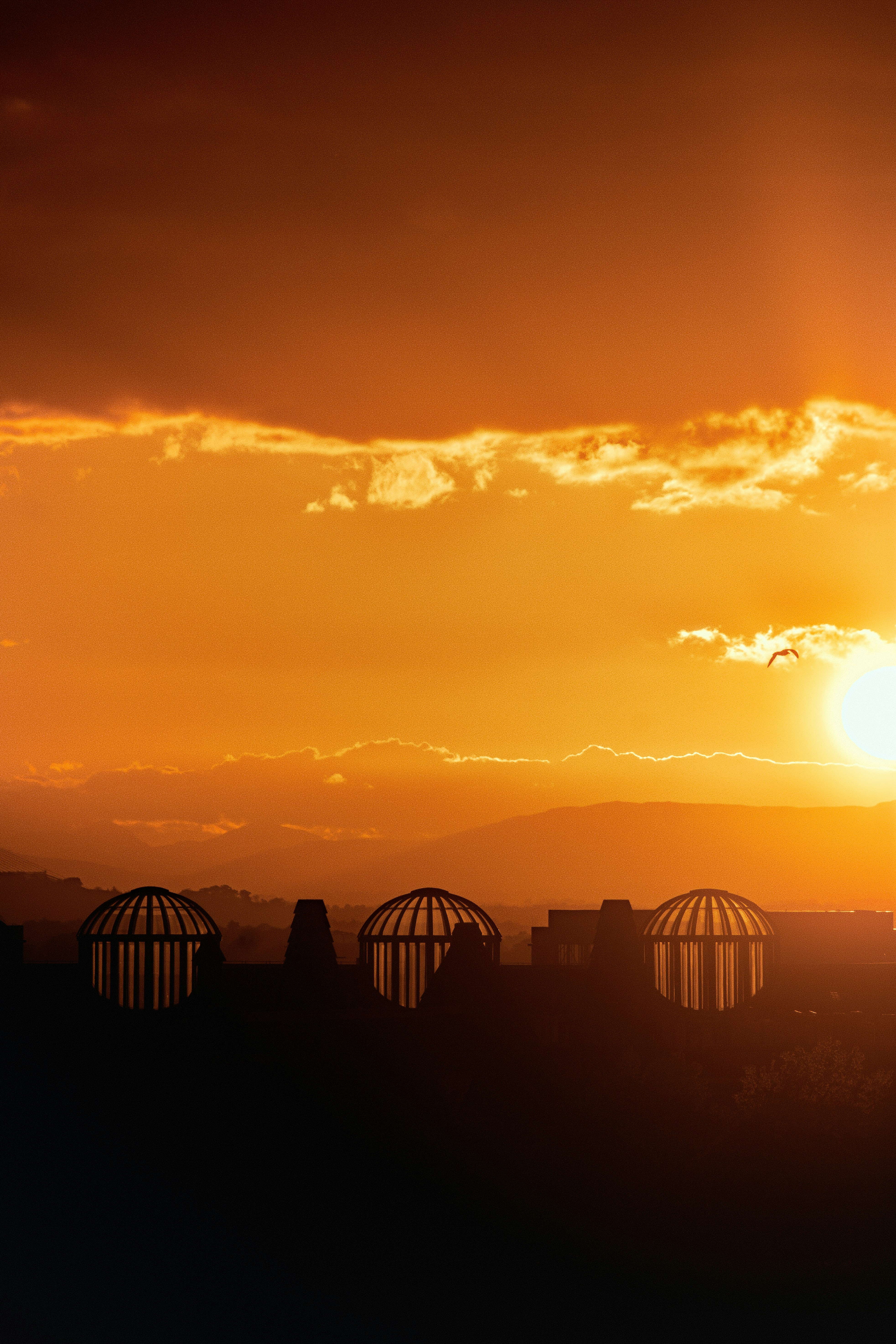 Sunset Rim: Silhouetted Domes Against a Glowing Sky