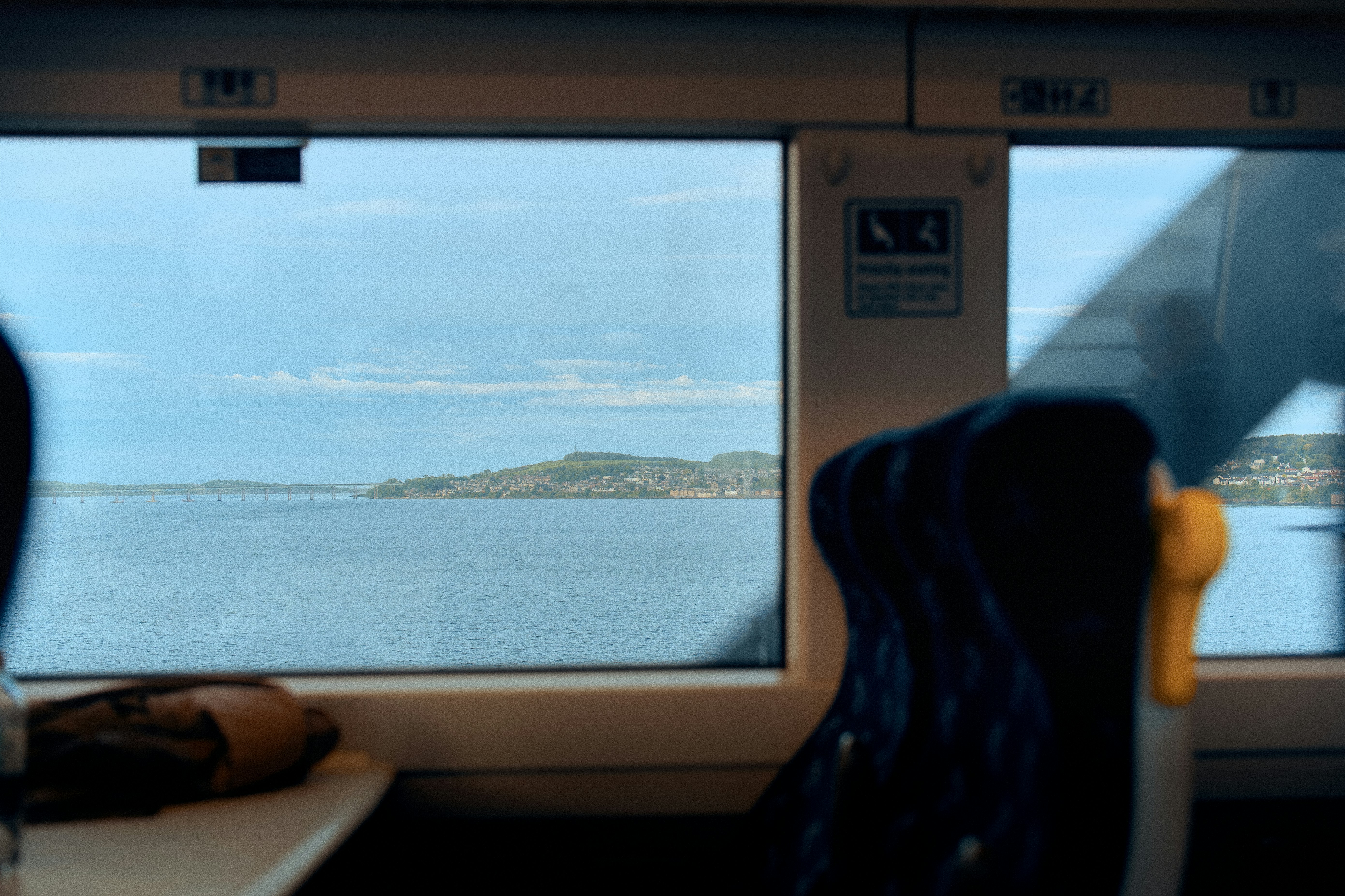 Window to the Channel: Quiet Sea Through a Train Cabin