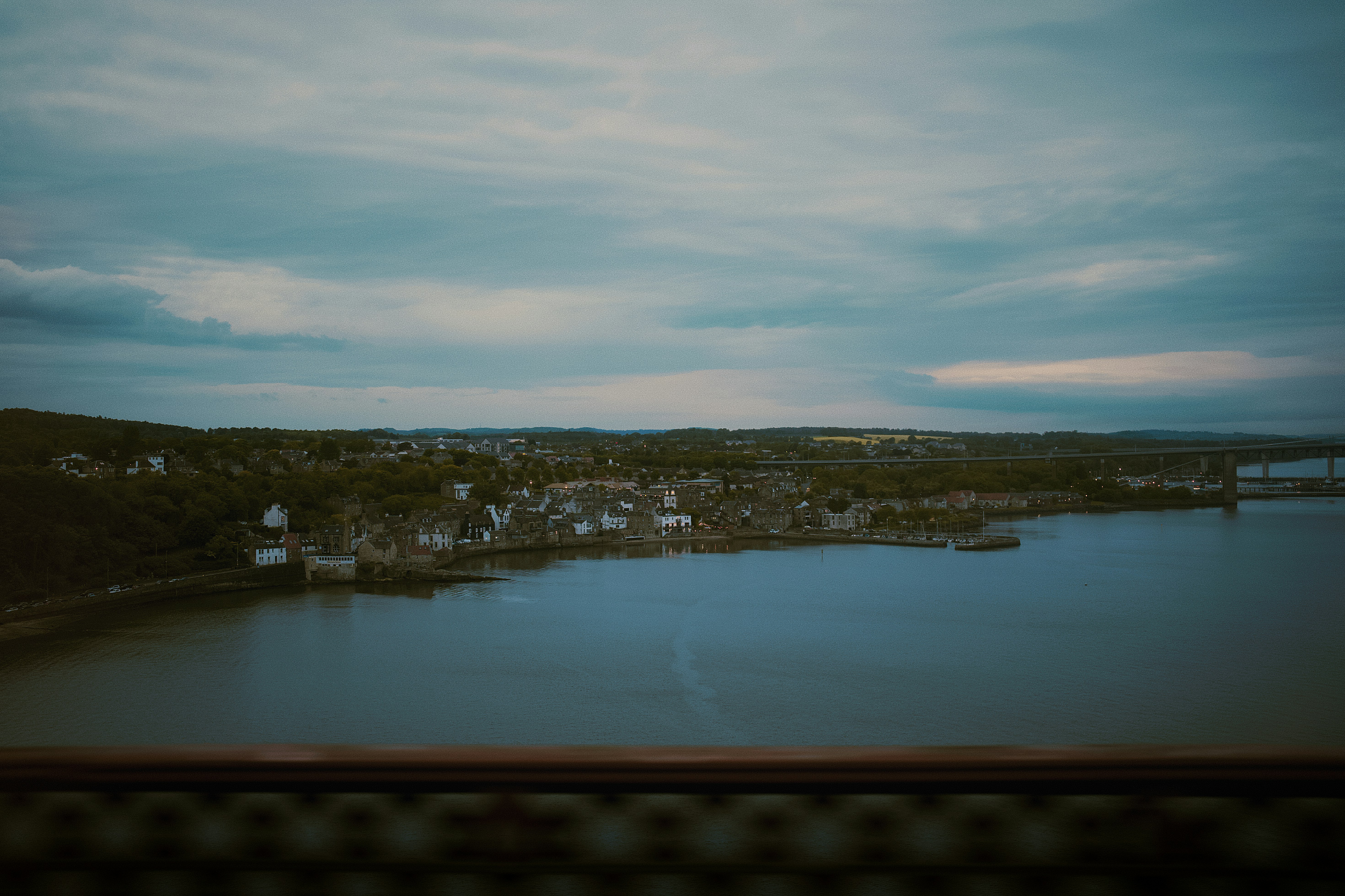 River Town Silhouette under a Calm Sky